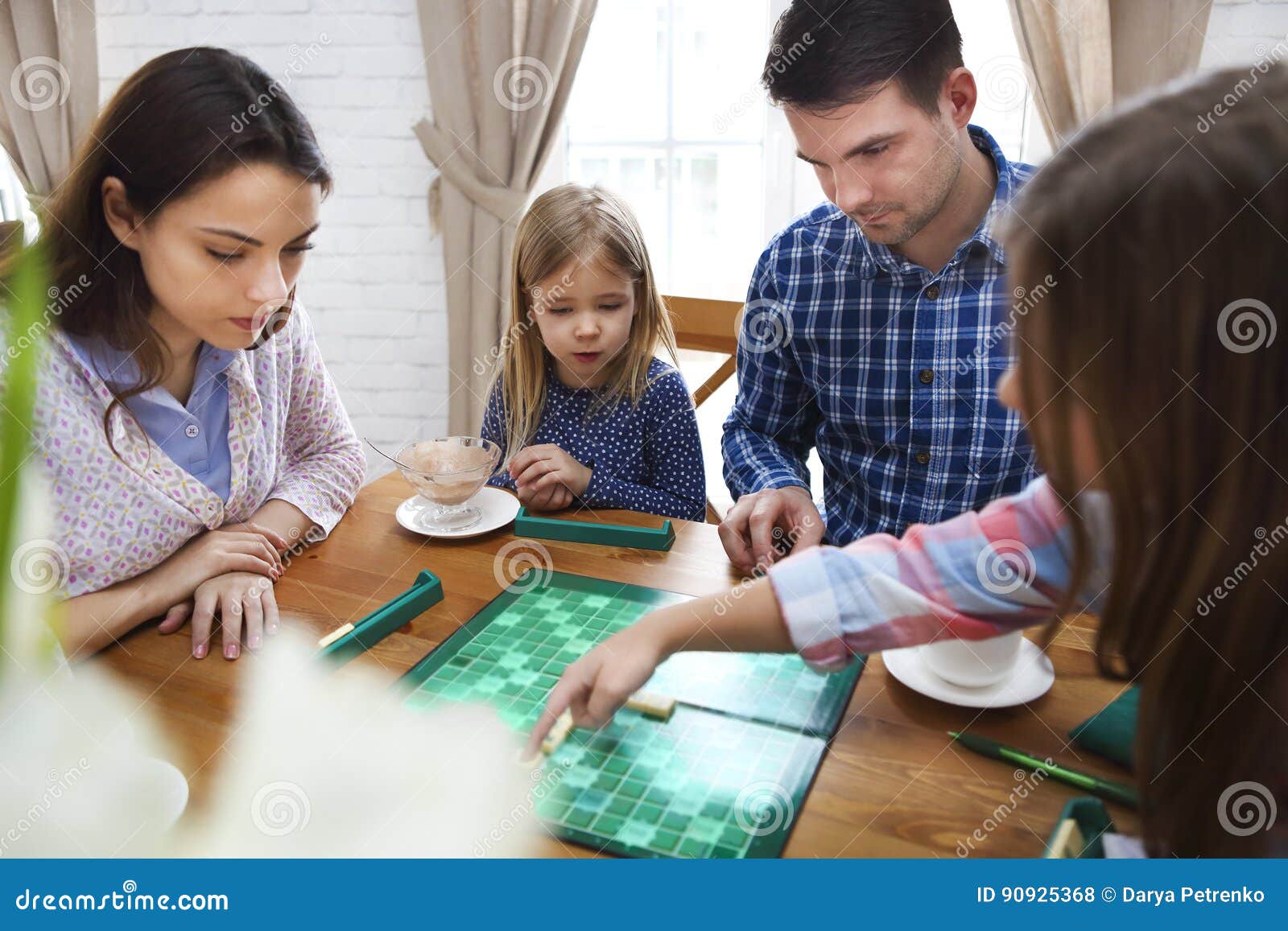Happy Young Family Plaing Board Game Stock Photo - Image of indoor ...