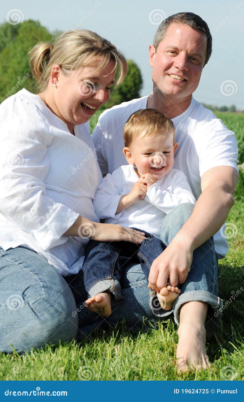 Happy Young Family with Small Child Stock Image - Image of jeans, teeth ...