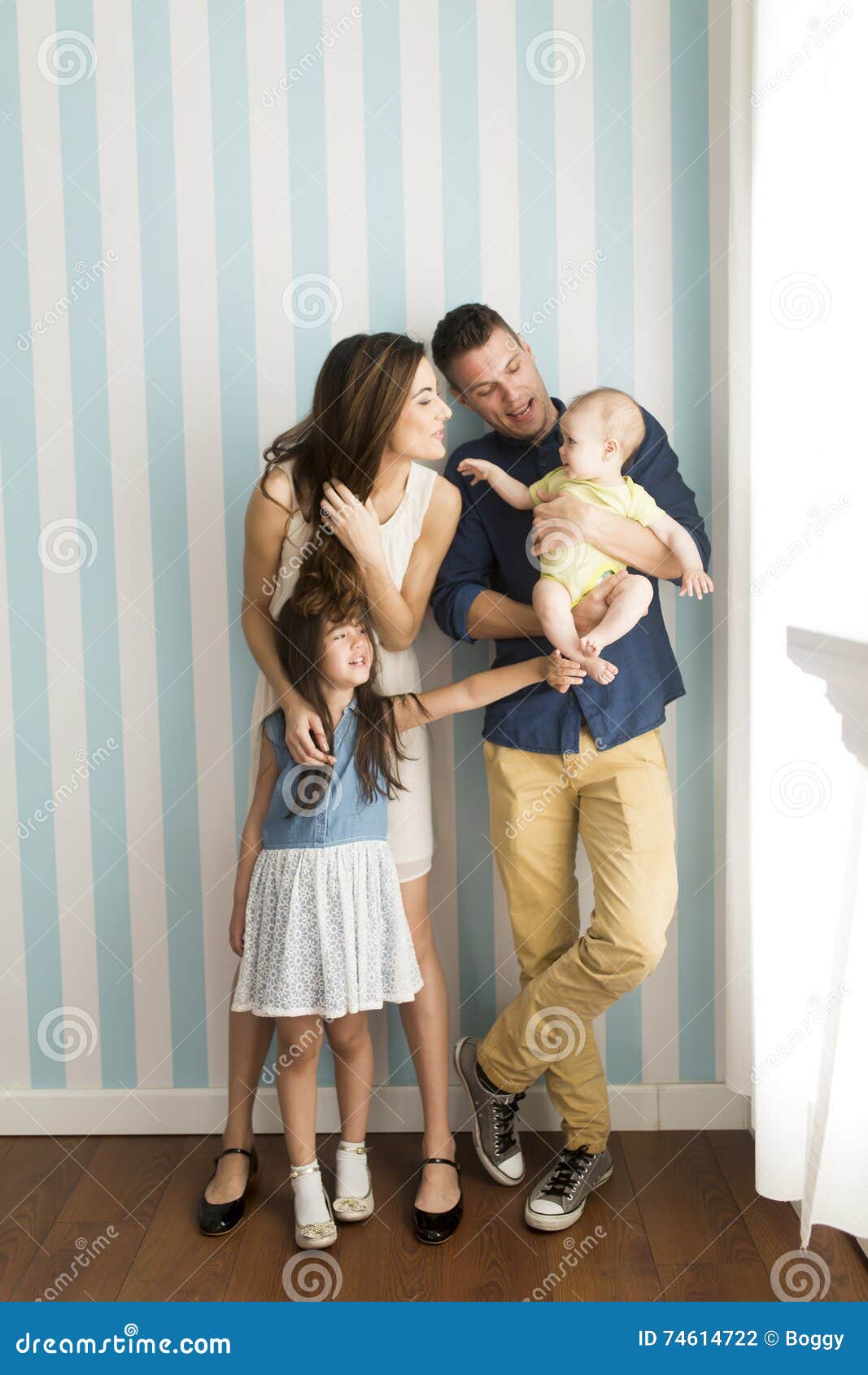 Happy young family stock photo. Image of together, baby - 74614722