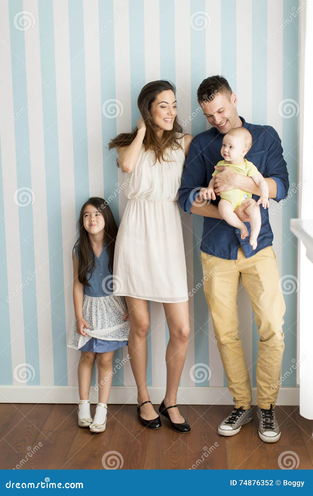 Happy young family stock photo. Image of young, toddler - 74876352