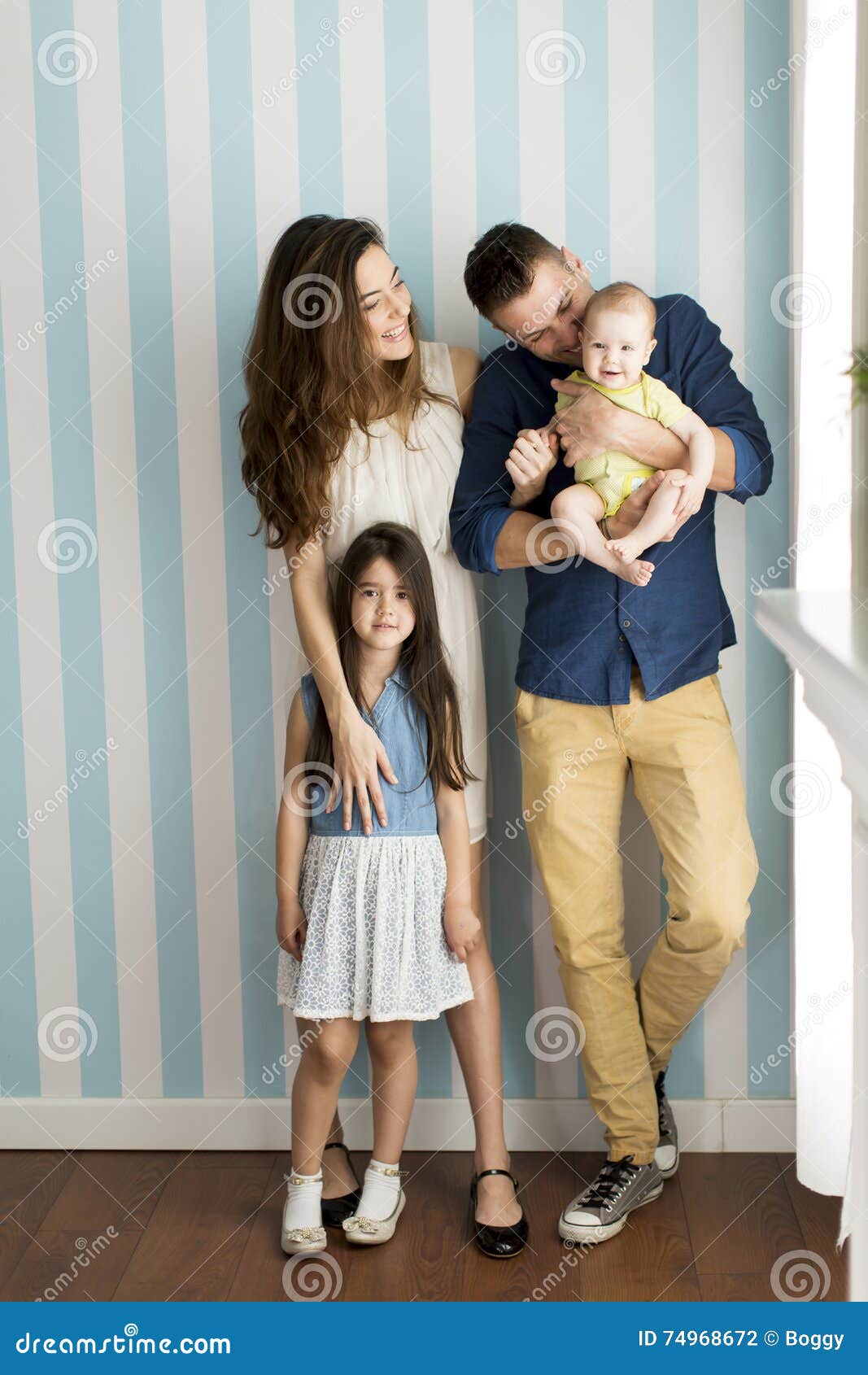 Happy young family stock photo. Image of mother, father - 74968672