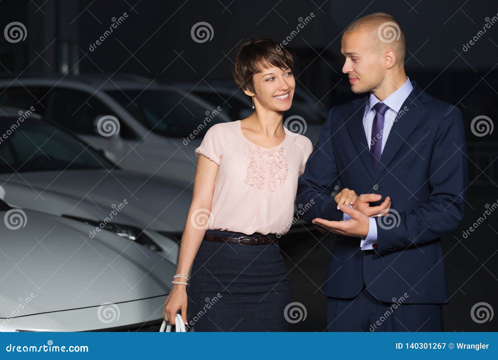 Happy Young Fashion Couple In Love Walking On City Street At Night