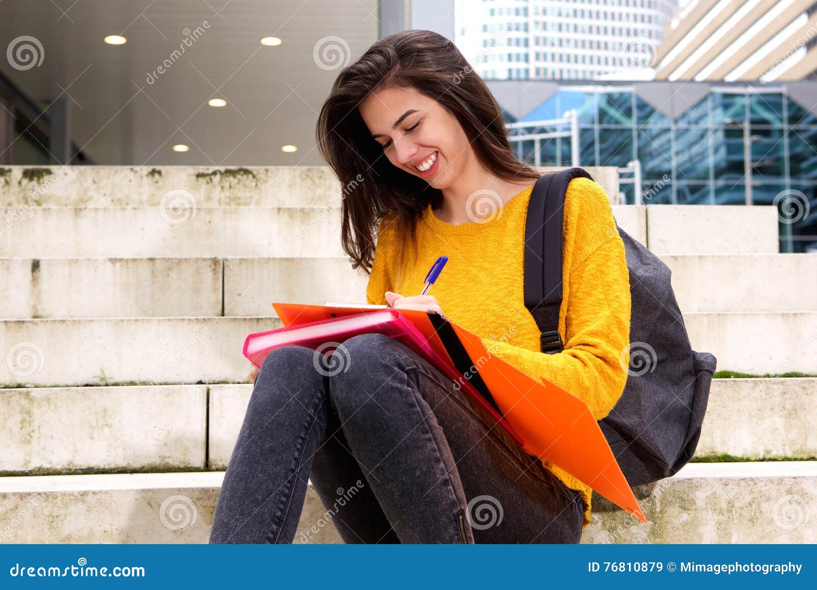 Happy Young Female Student Taking Notes on Steps Stock Image - Image of ...
