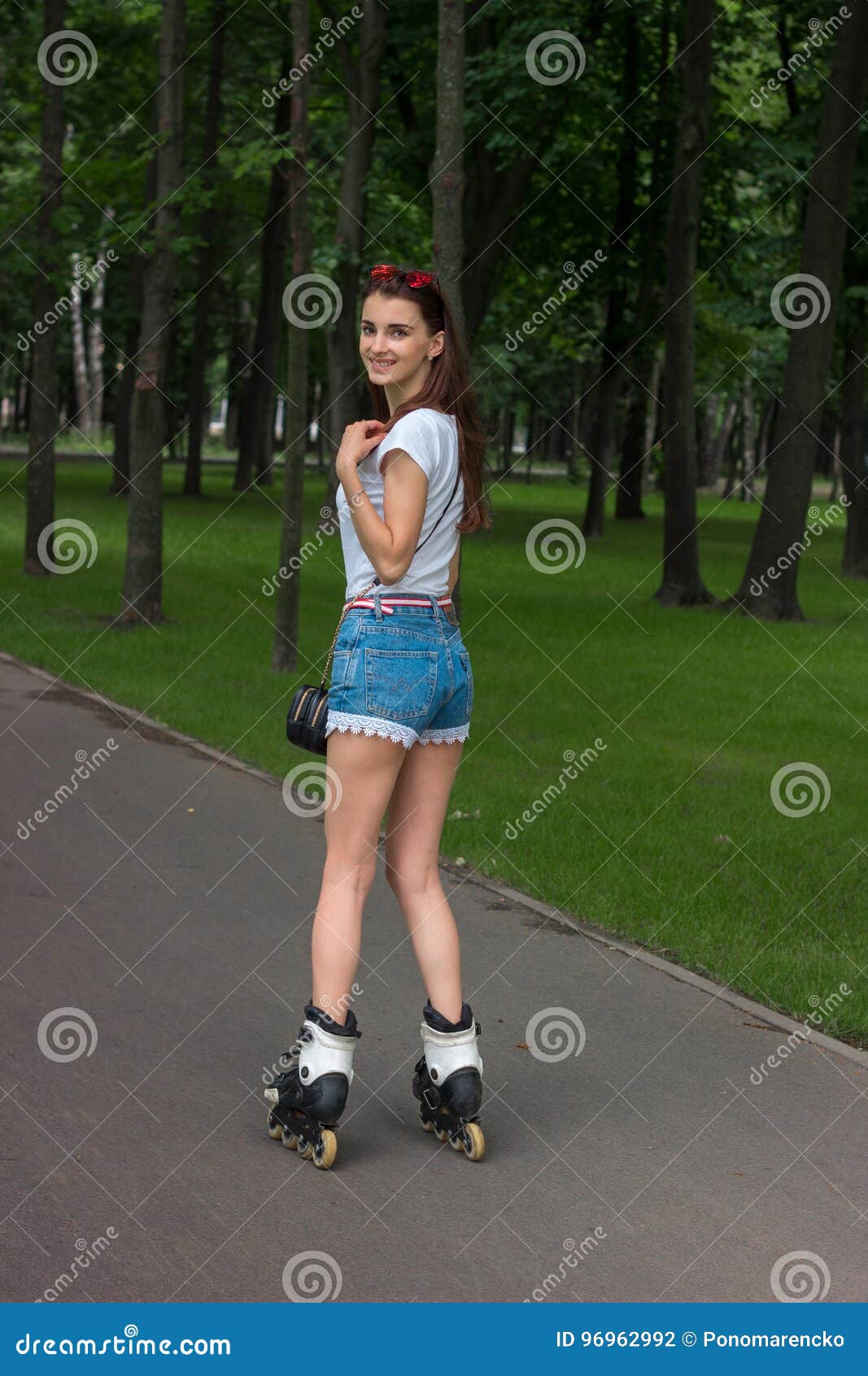 Happy Young Girl Rollerblading Stock Photo - Image of brunette, park ...