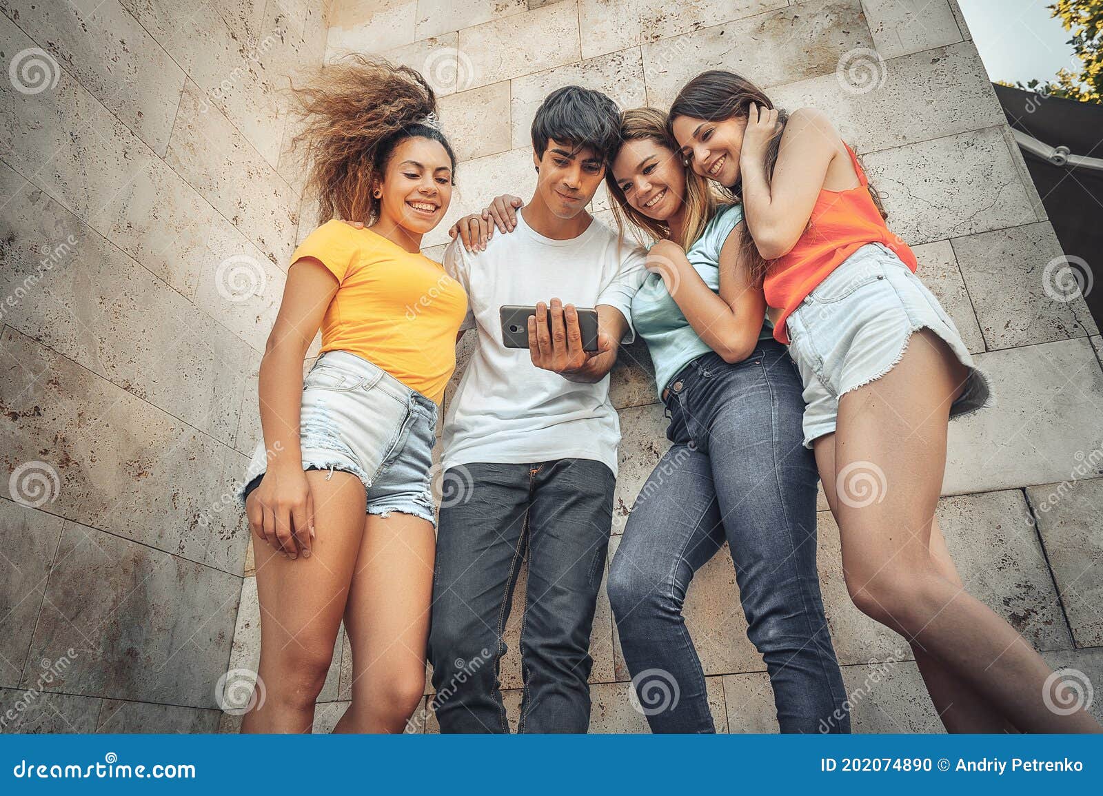 Young Group on Street with Cellphone Stock Photo - Image of city ...