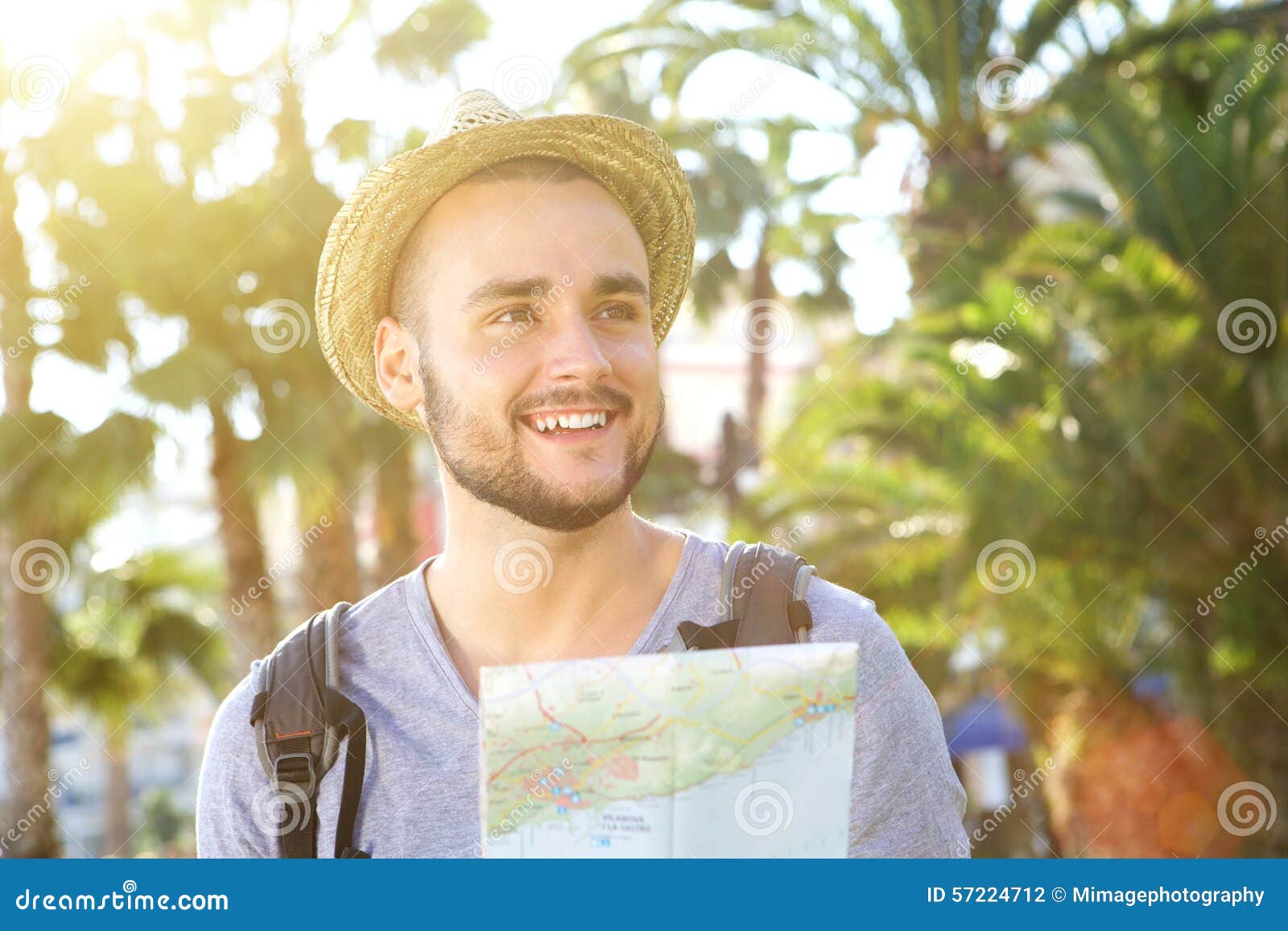 Happy Young Guy on Vacation Holding Map Stock Photo - Image of fashion ...