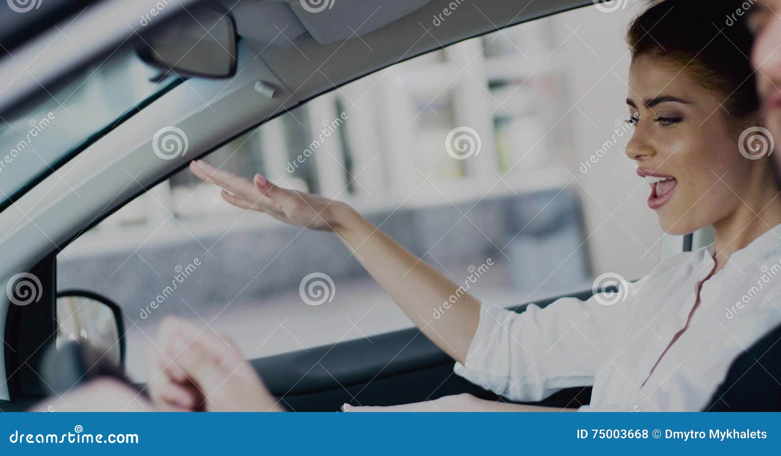 Happy Young Hipster Couple Dancing And Singing Like Crazy In Car