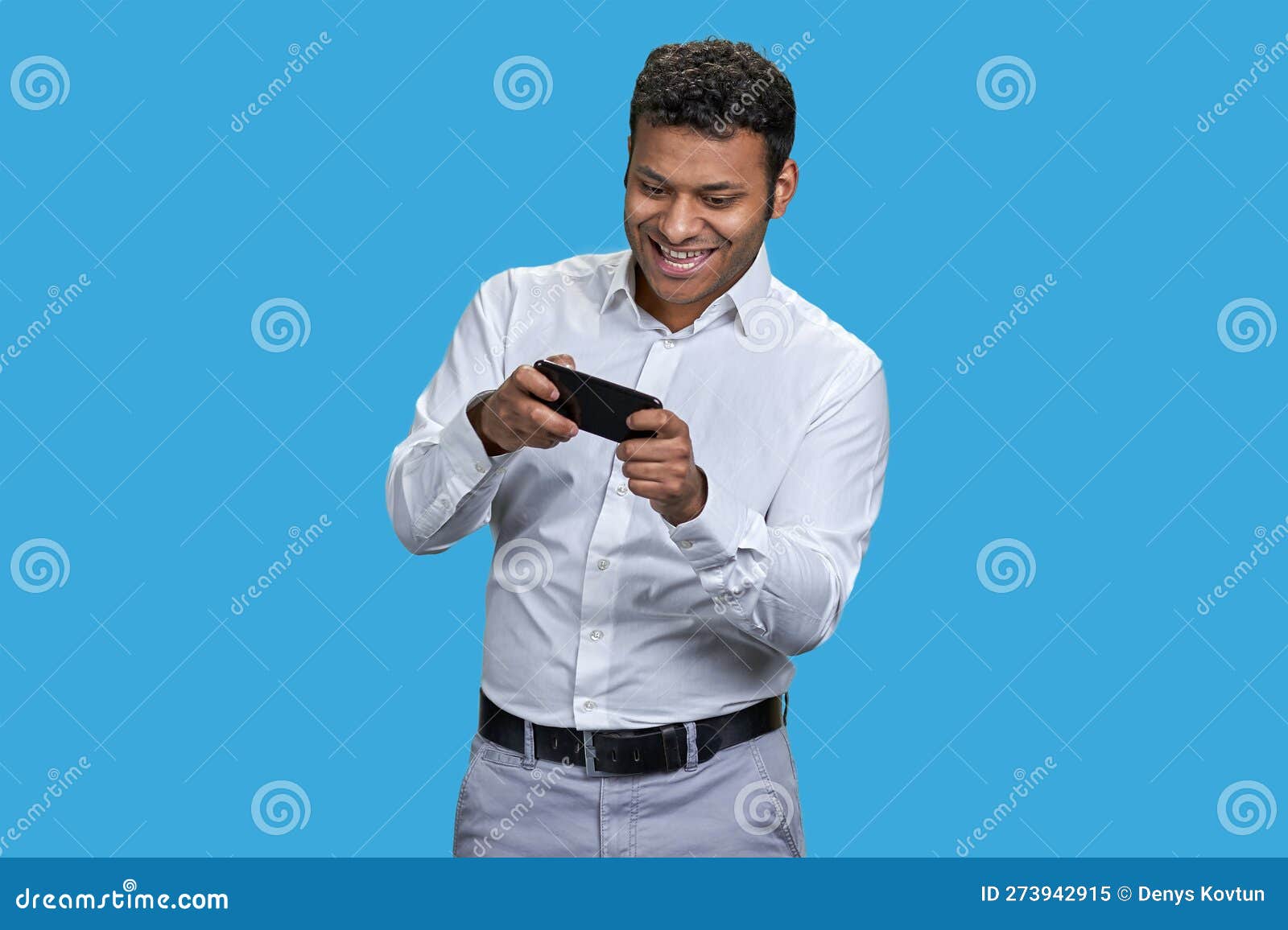 Happy Young Indian Man Playing Video Game Using Smartphone. Stock Image ...