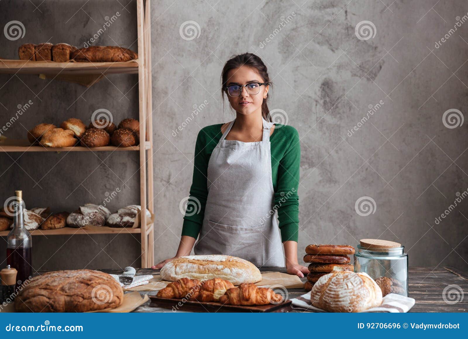 Happy Young Lady Baker Standing at Bakery Near Bread Stock Photo ...