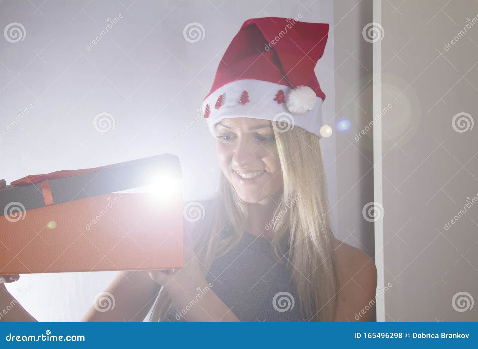 A Happy Young Lady.Opens a Magic Box.New Year 2020 Stock Photo - Image ...