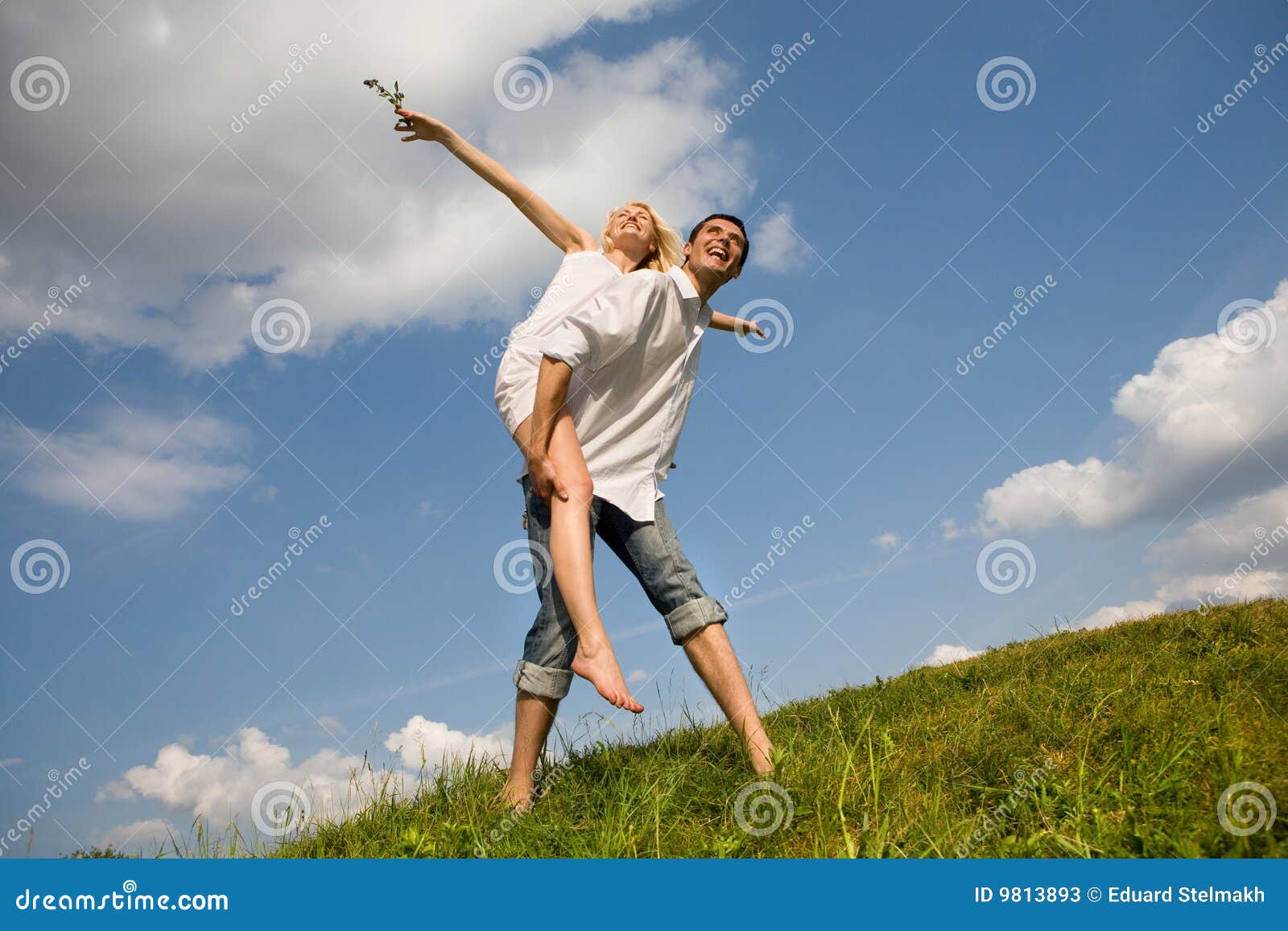 Happy Young Love Couple - Jumping Stock Image - Image of blue, clouds ...
