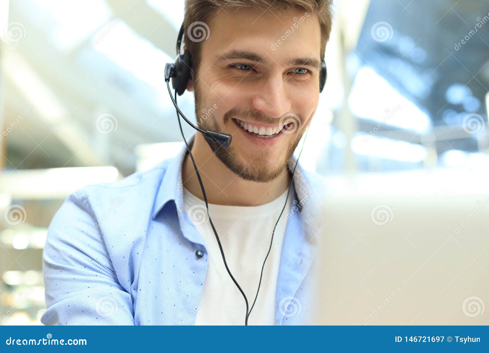 Happy Young Male Customer Support Executive Working in Office Stock ...
