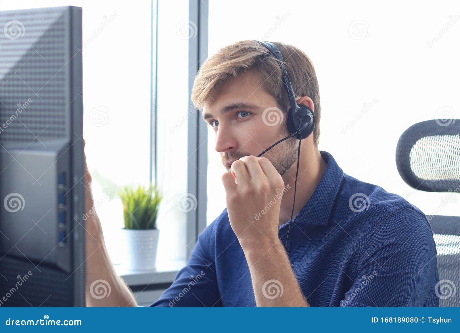 Happy Young Male Customer Support Executive Working in Office Stock ...