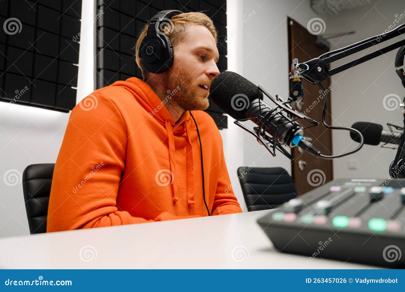 Happy Young Male Radio Host Broadcasting in Studio Stock Photo - Image ...