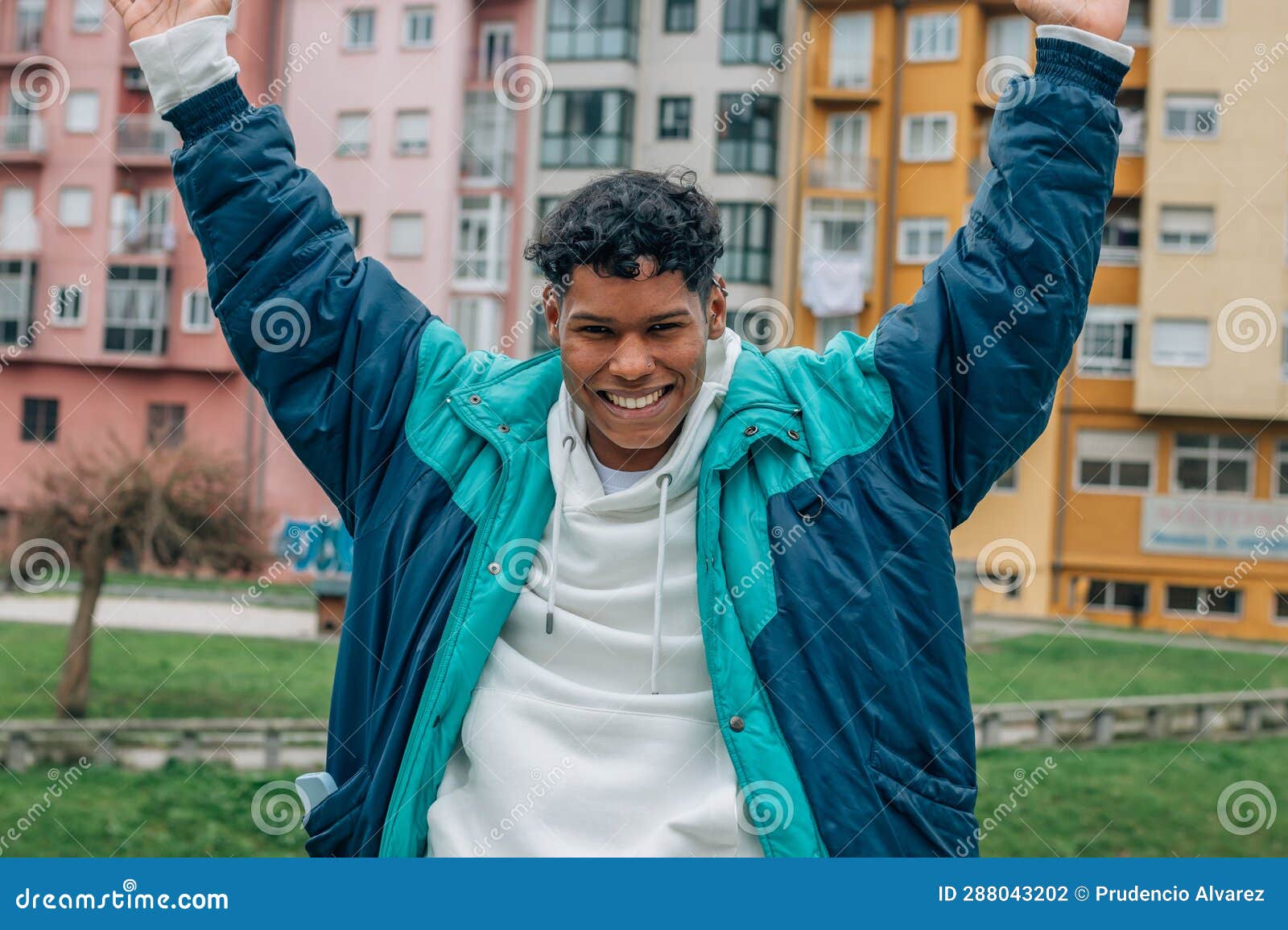 Young Man with Arms Raised Outdoors Stock Photo - Image of success ...