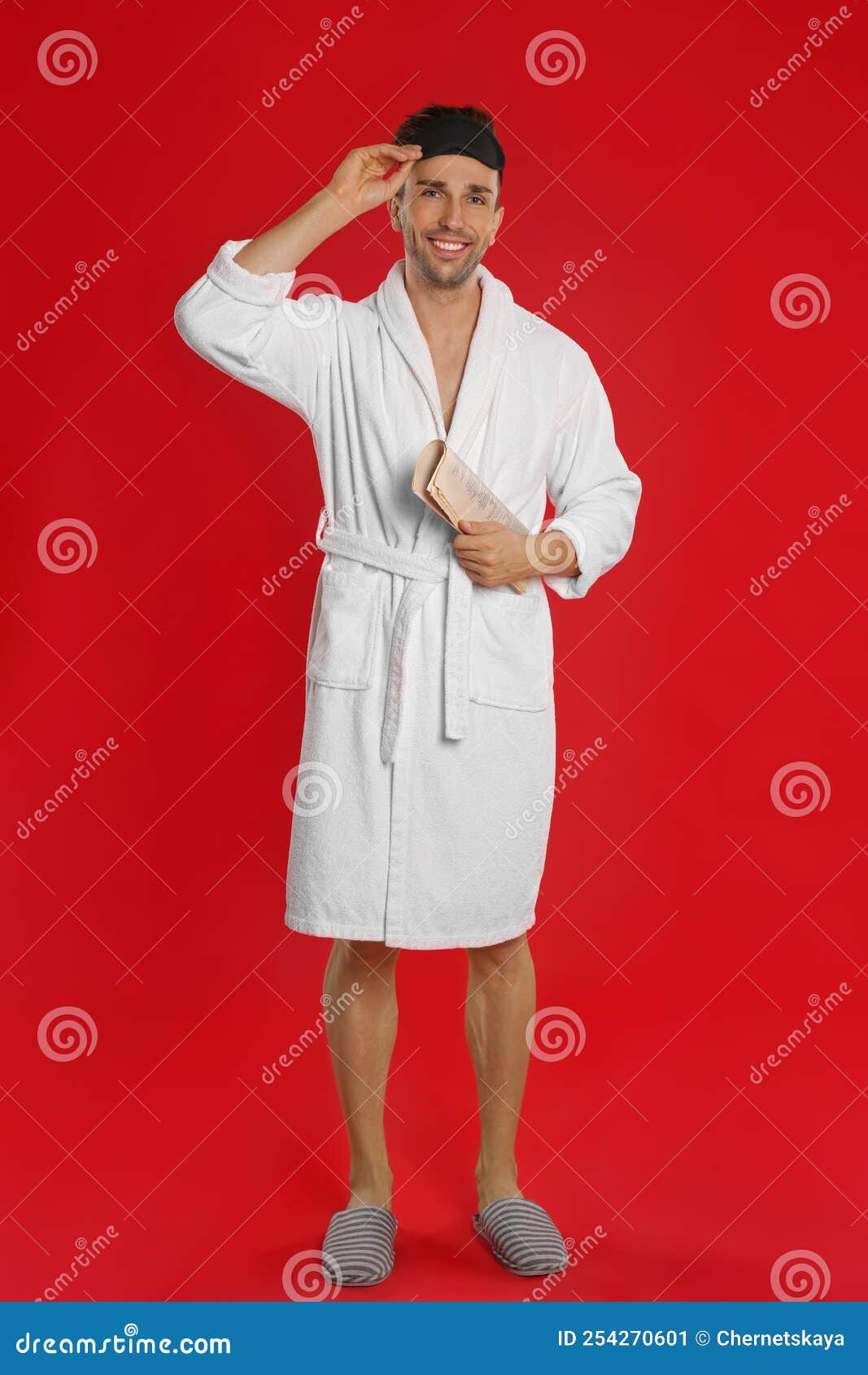 Happy Young Man in Bathrobe with Newspaper on Red Background Stock ...