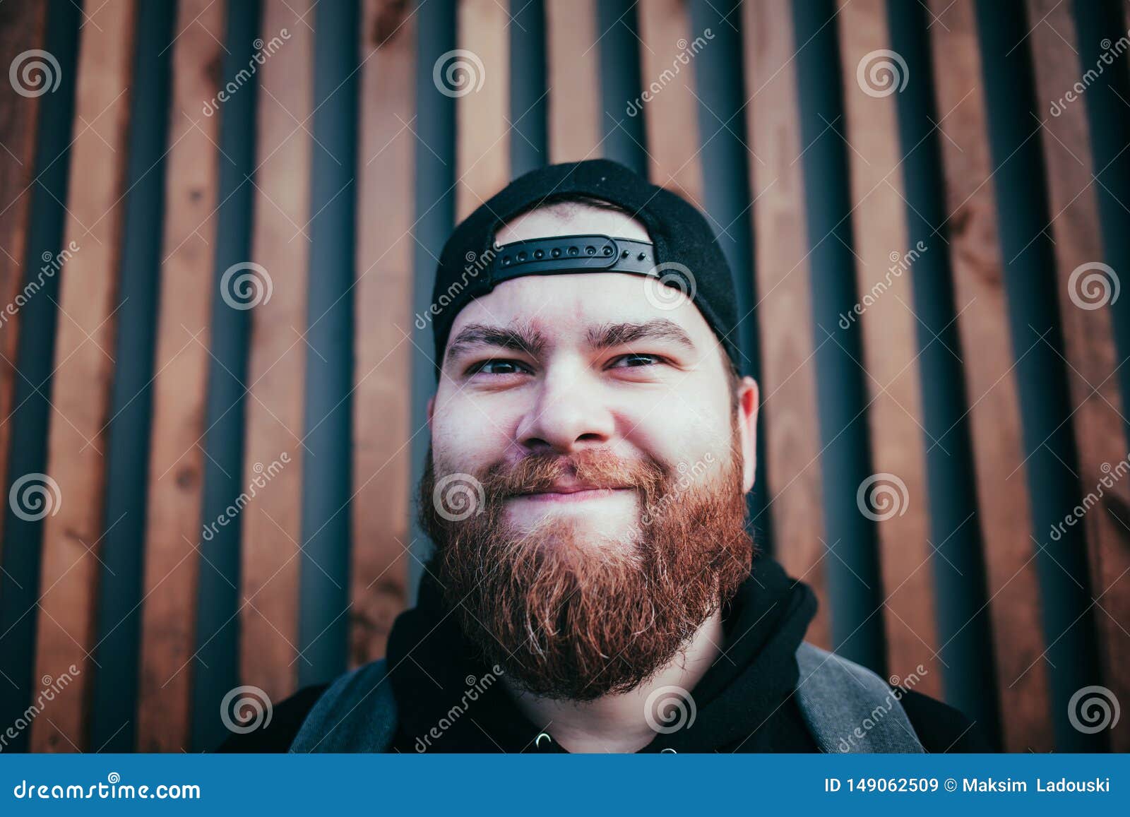 Happy young man in cap stock image. Image of smiling - 149062509