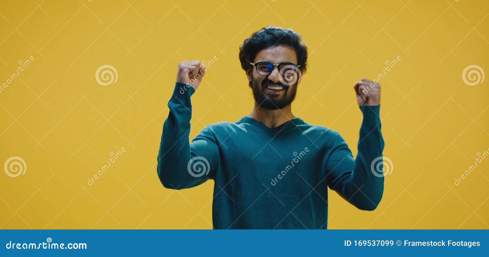 Happy young man cheering stock image. Image of success - 169537099