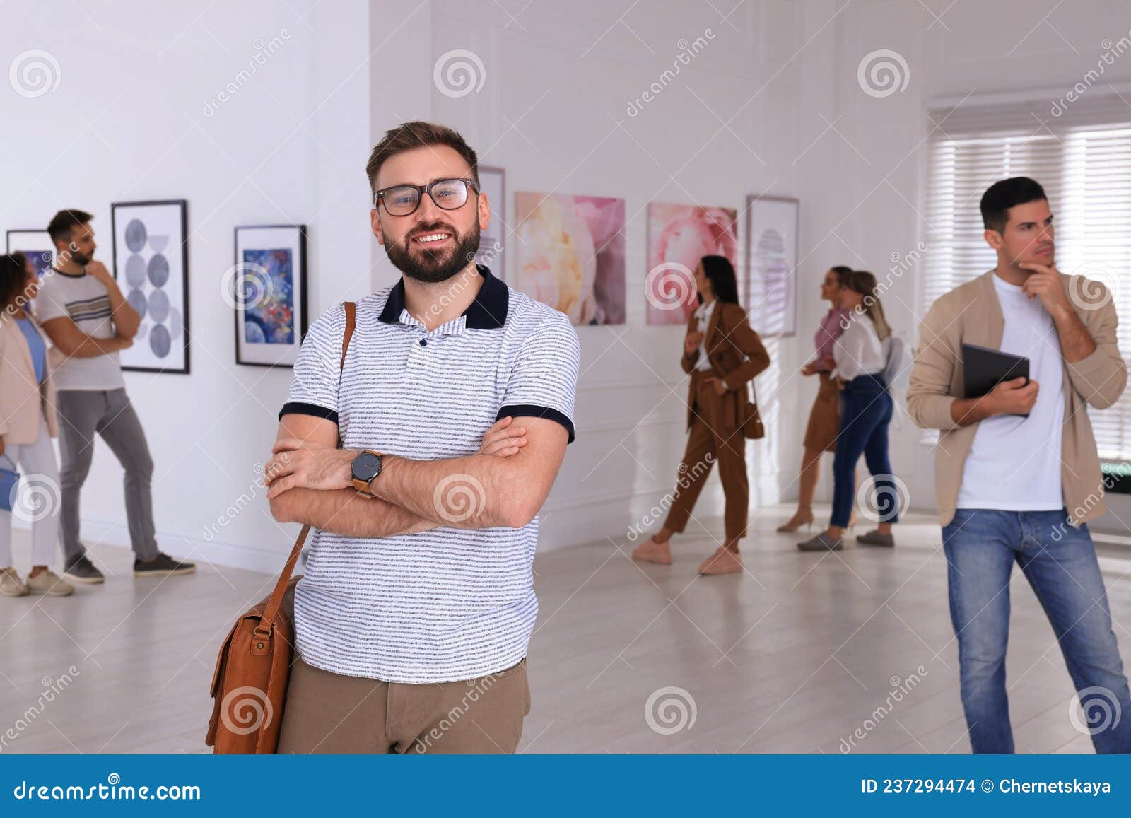 Happy Young Man at Exhibition in Art Gallery Stock Photo - Image of ...