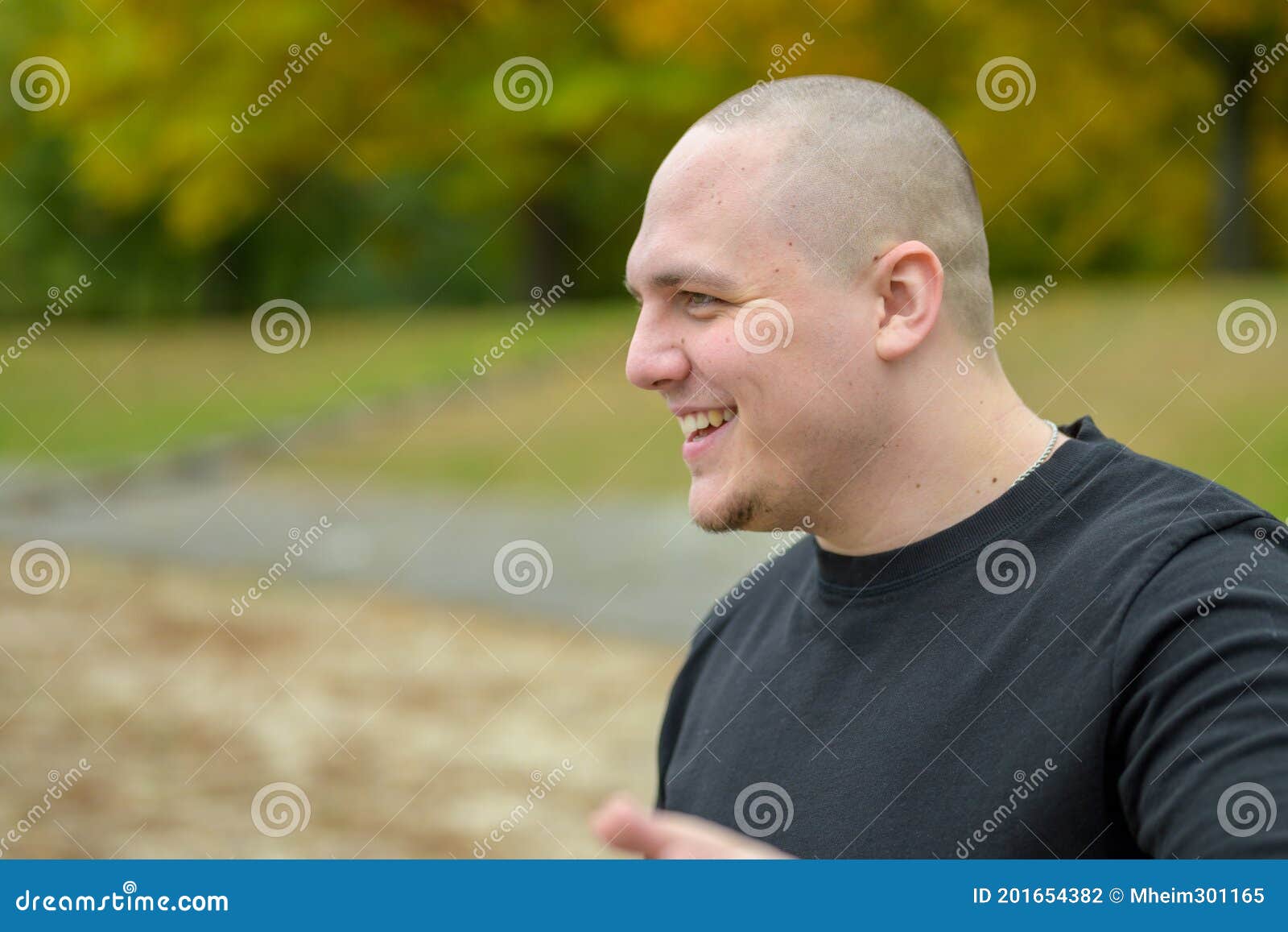 Happy Young Man Grinning As he Looks To the Side Stock Photo - Image of ...