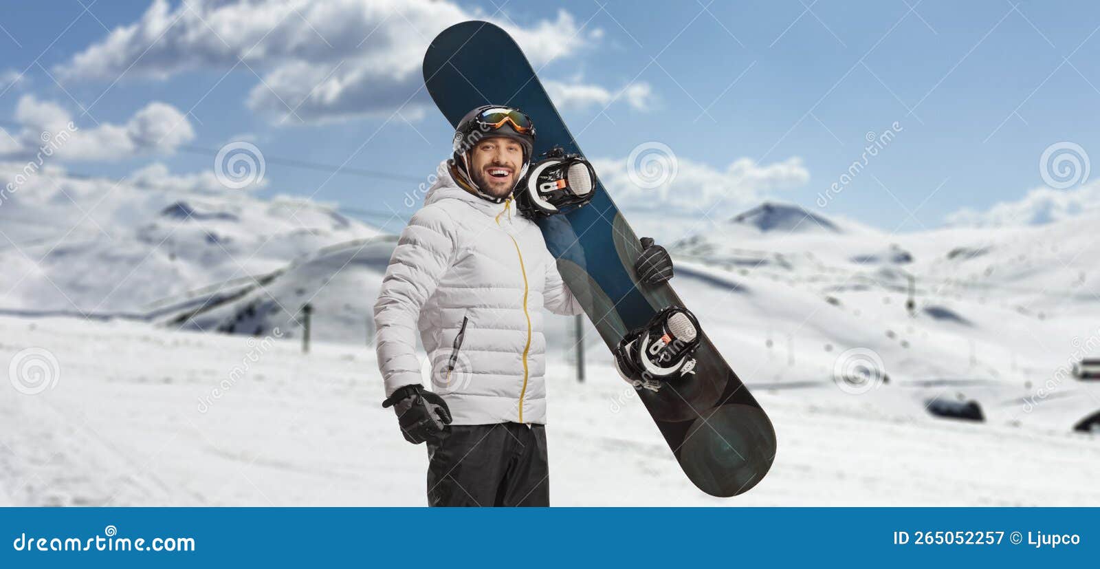 Happy Young Man Holding a Snowboard and Looking at Camera Stock Image ...