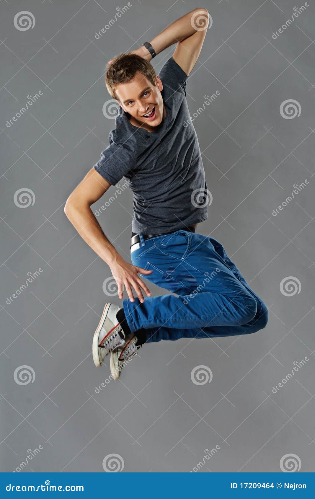 Happy young man jumping stock photo. Image of masculine - 17209464