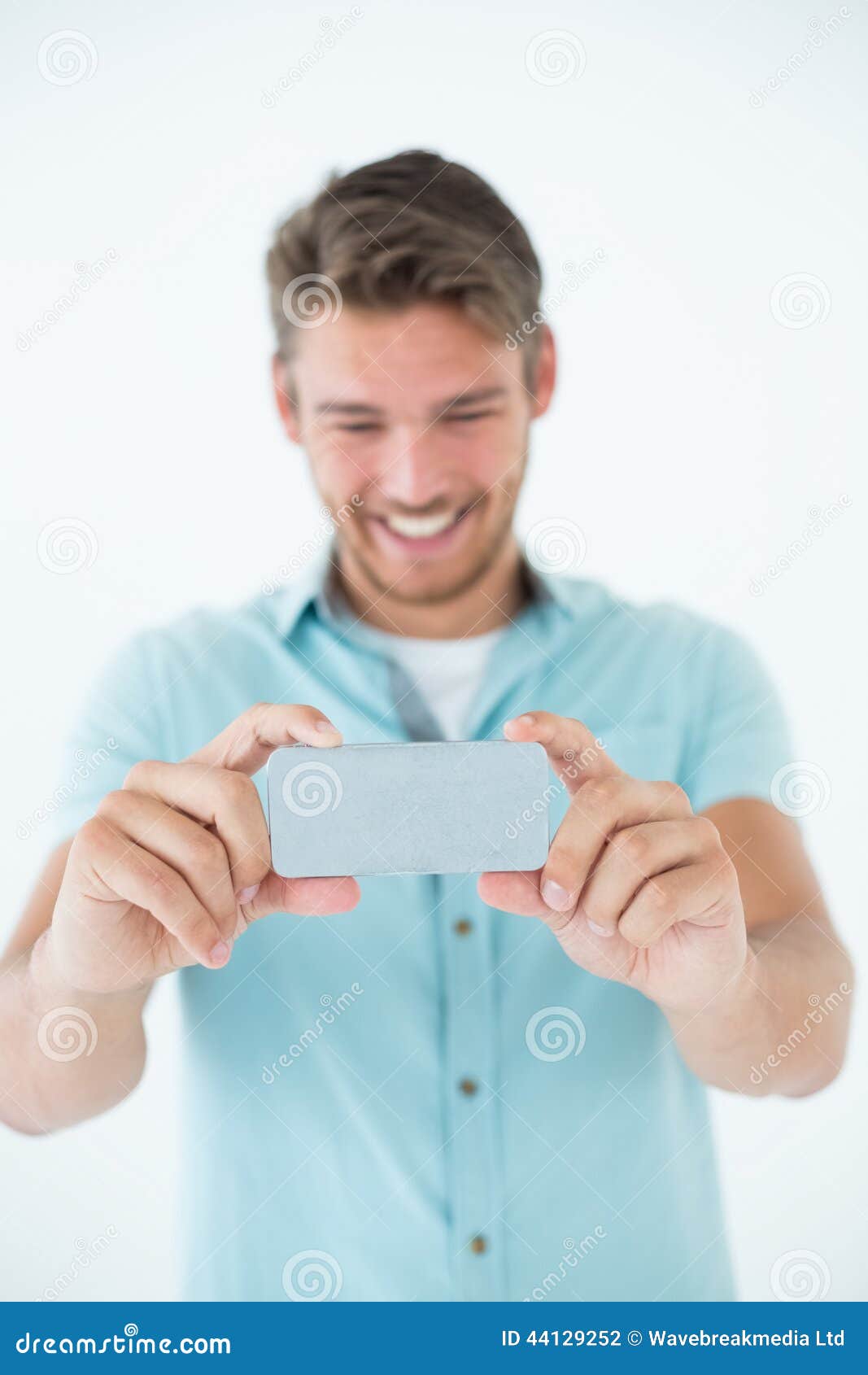 Happy Young Man Looking at His Mobile Phone Stock Photo - Image of ...