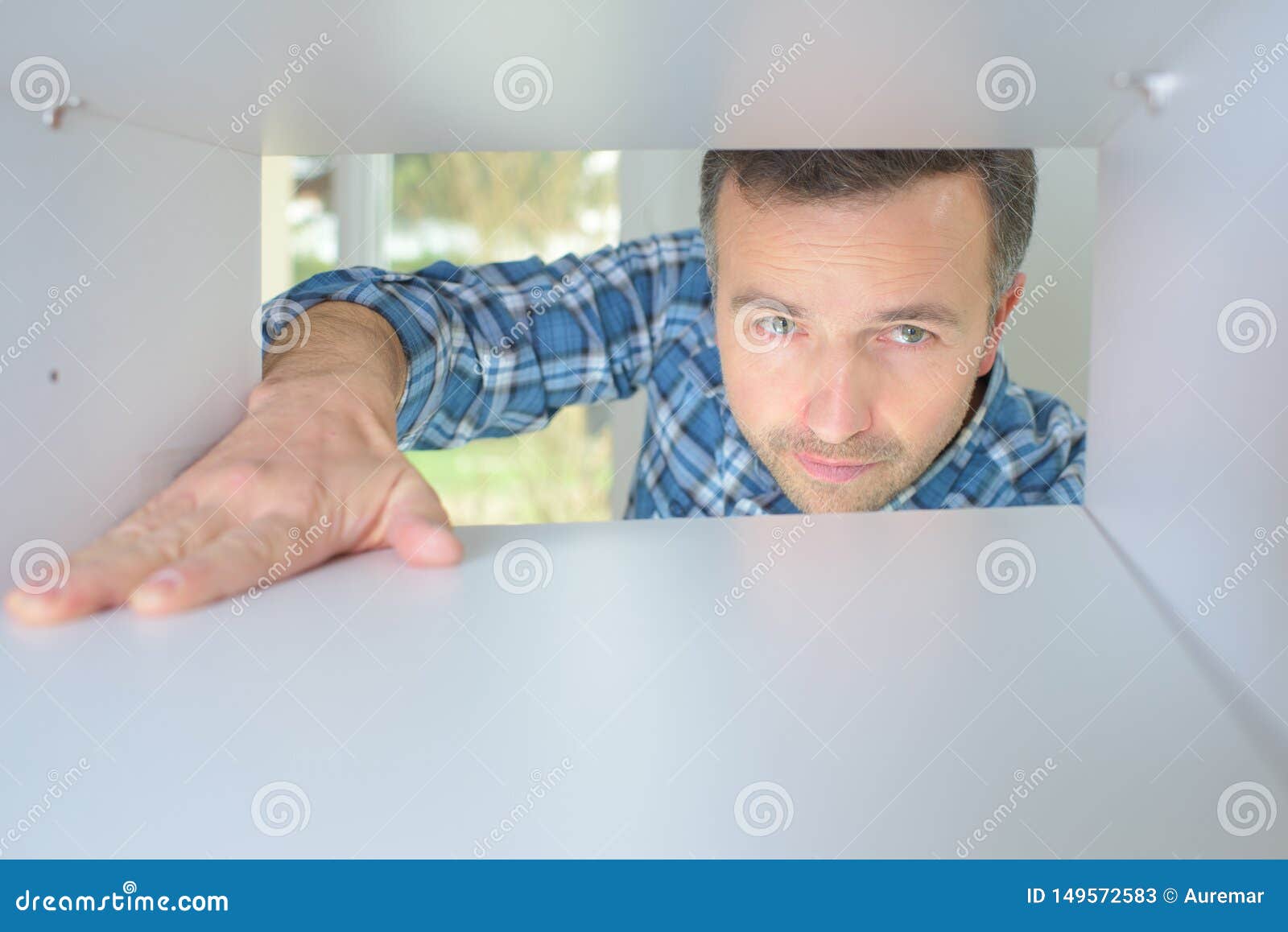 Happy Young Man Looking Inside Box Stock Image - Image of concept ...