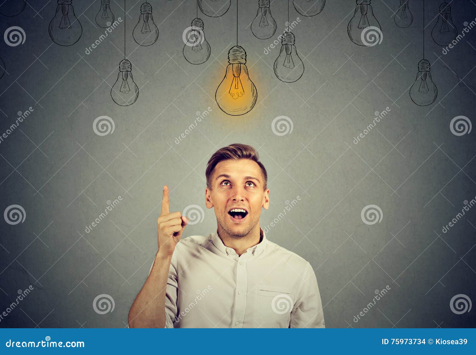 Happy Young Man Pointing at Light Bulb Has a Solution Stock Photo ...