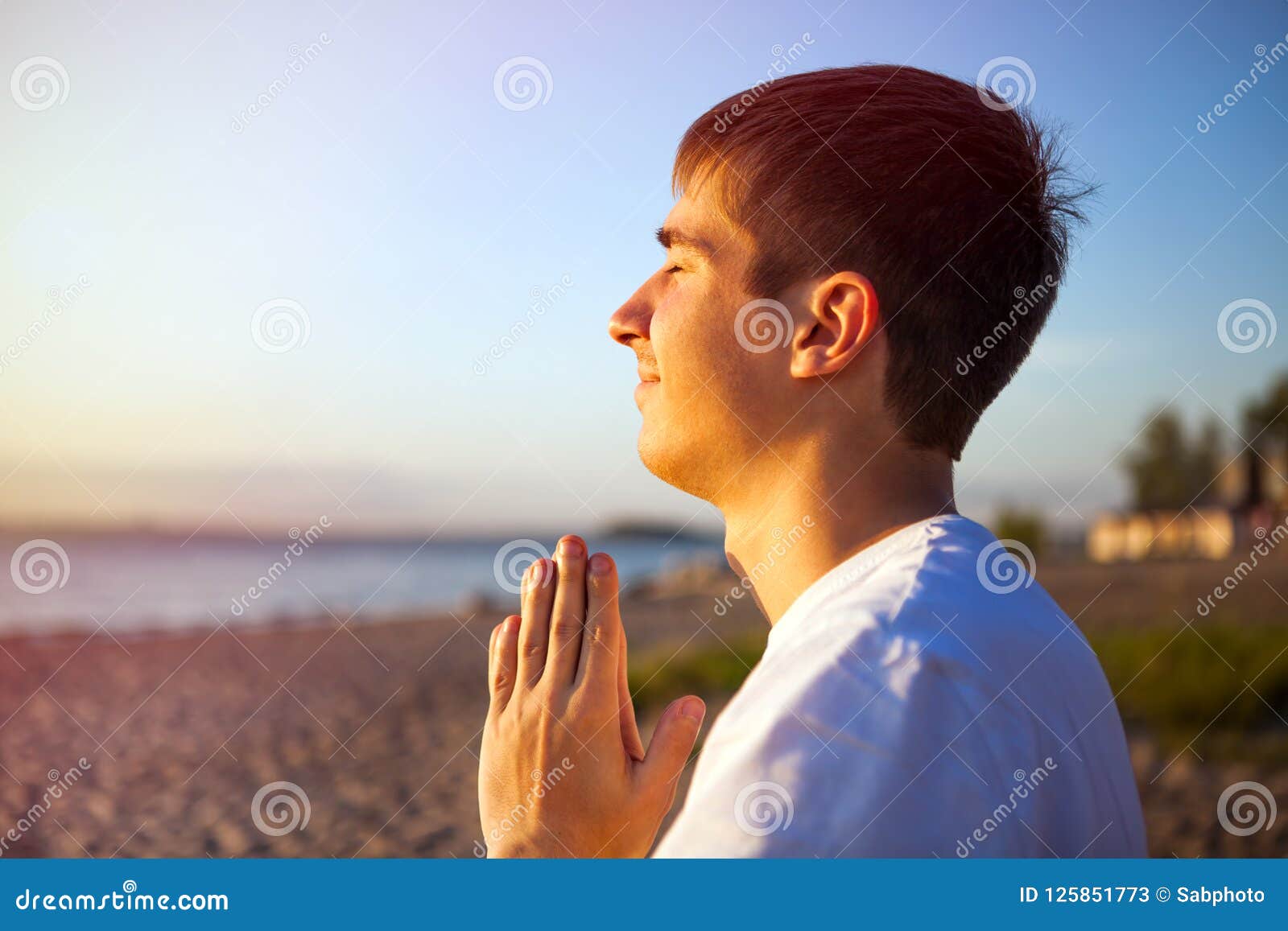 Young Man praying stock image. Image of quiet, seashore - 125851773