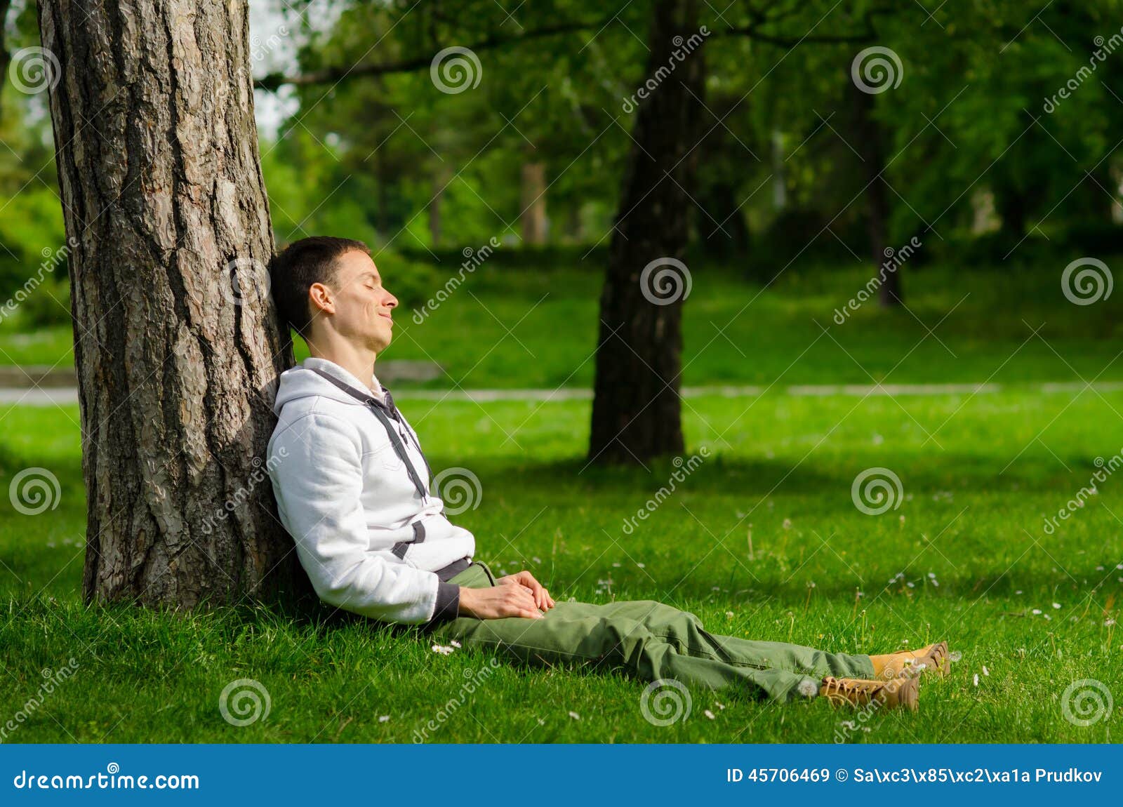 Happy Young Man Relaxing in the Park on Sunny Spring Day Stock Image ...