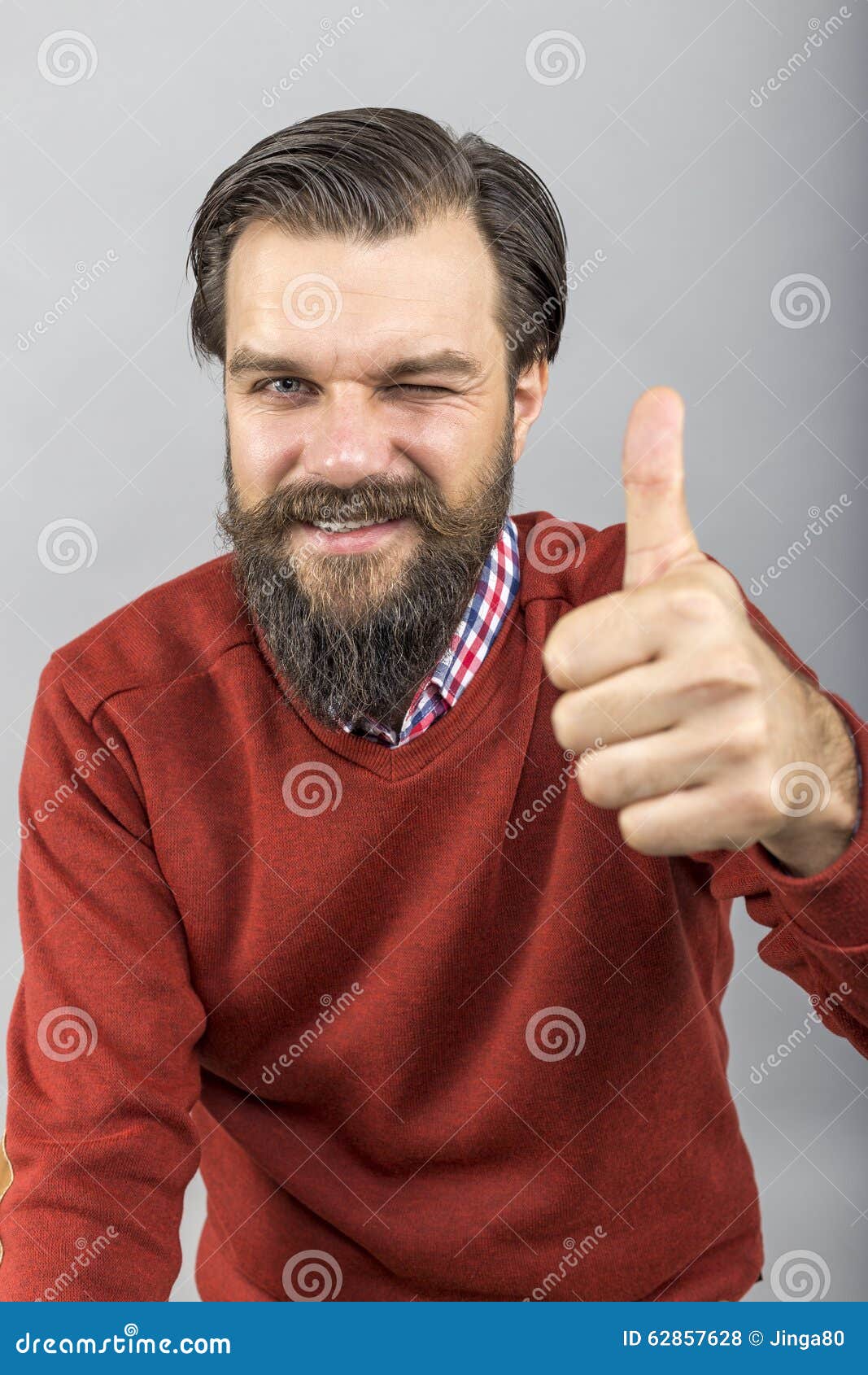 Happy Young Man Showing OK Sign With His Thumb Up And Blinking Stock ... Happy Young Man Showing OK Sign With His Thumb Up And Blinking Stock ...