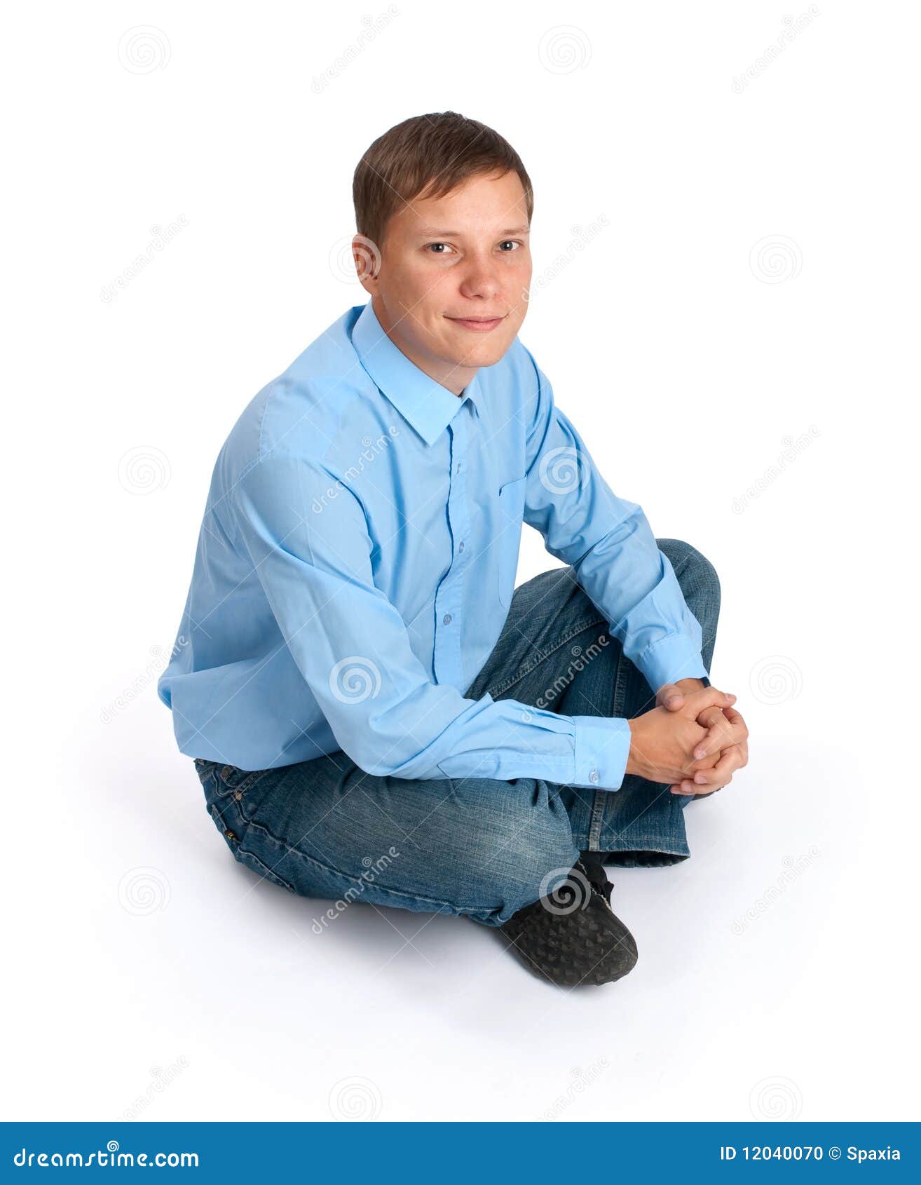 Happy young man sitting stock photo. Image of thinking - 12040070
