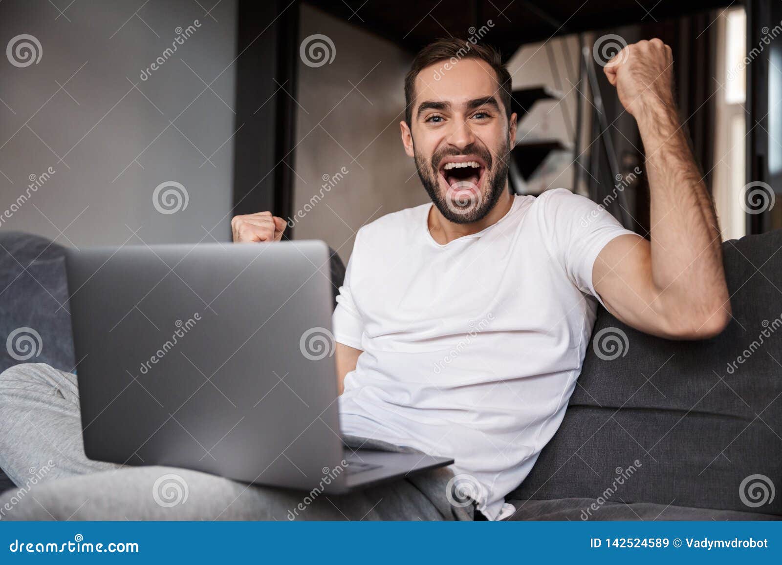 Happy Young Man Sitting on a Couch Stock Image - Image of modern ...