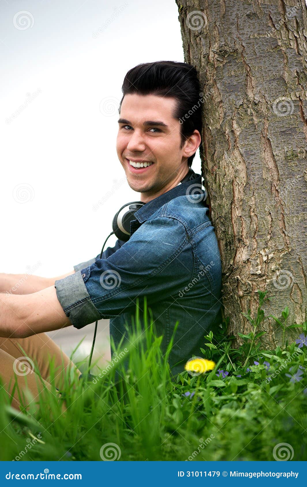 Happy Young Man Sitting in Nature Stock Image - Image of caucasian ...