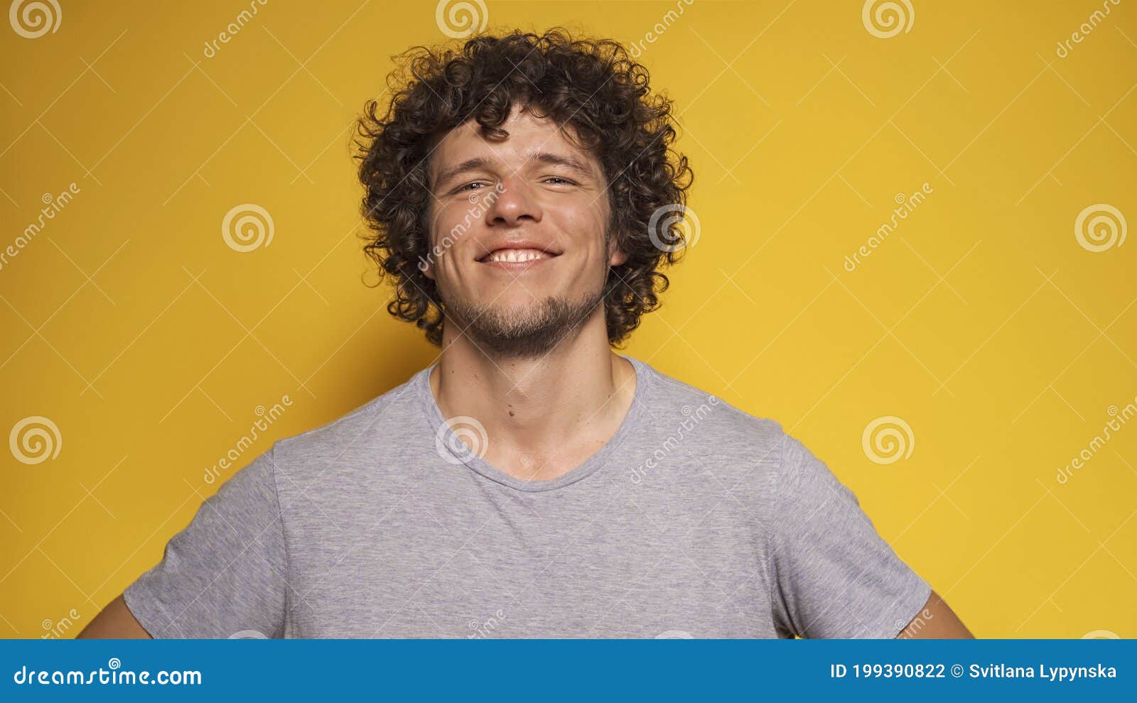 Happy Young Man Smiles Broadly Into Camera Portrait Of Confident