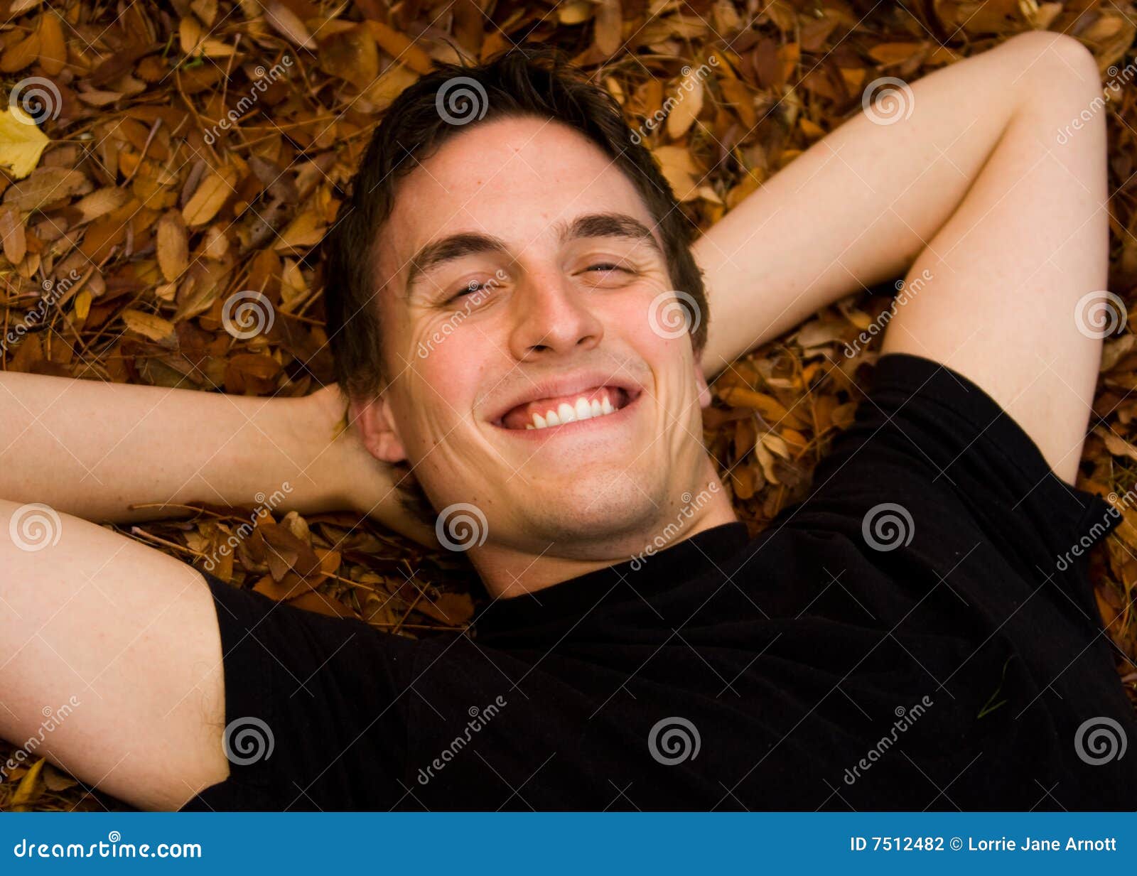 Happy Young Man Smiling in Fall Leaves Stock Photo - Image of young ... Happy Young Man Smiling in Fall Leaves Stock Photo - Image of young ...