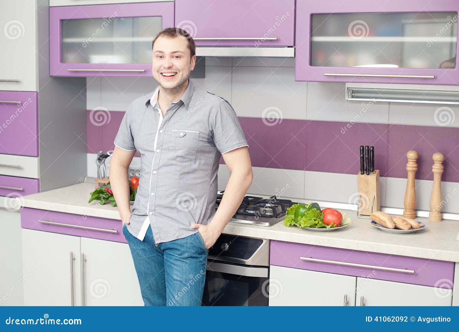 Happy Young Man Standing in His Modern Kitchen Stock Photo - Image of ...