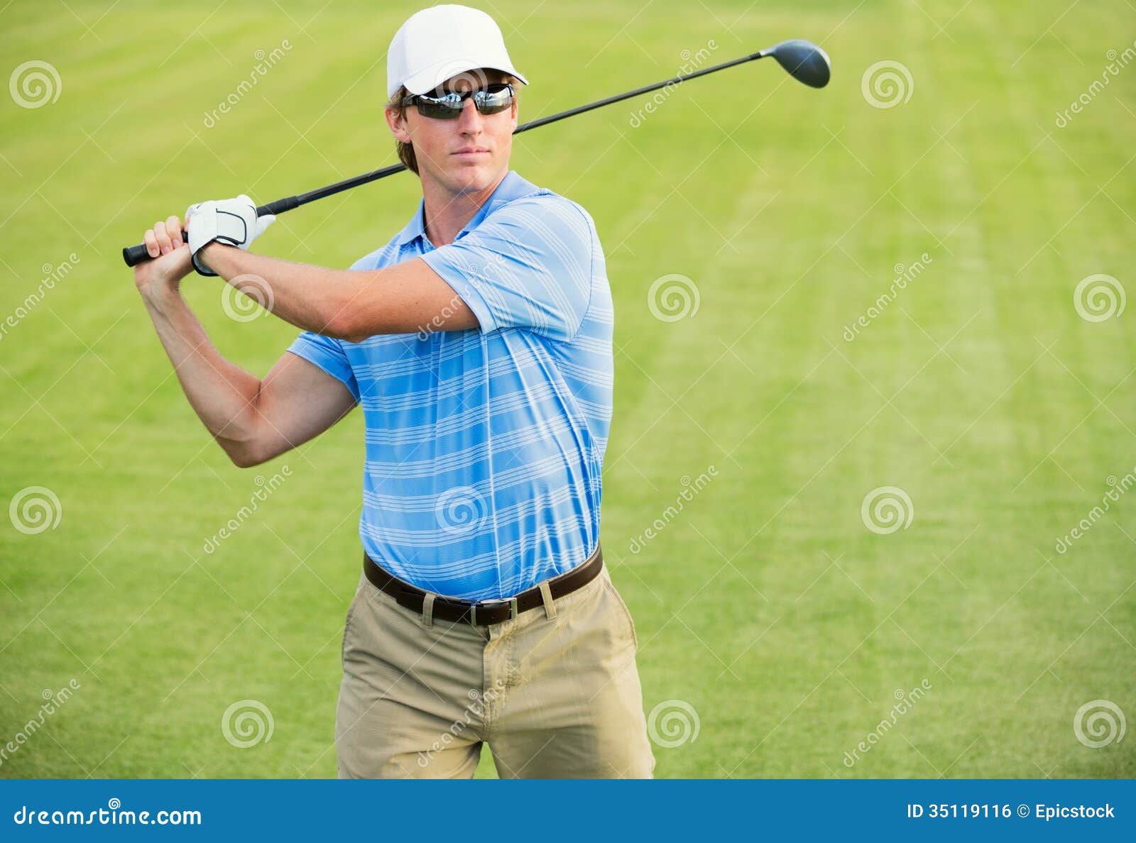Happy Young Man Swinging Golf Club Stock Photo - Image of outside ...