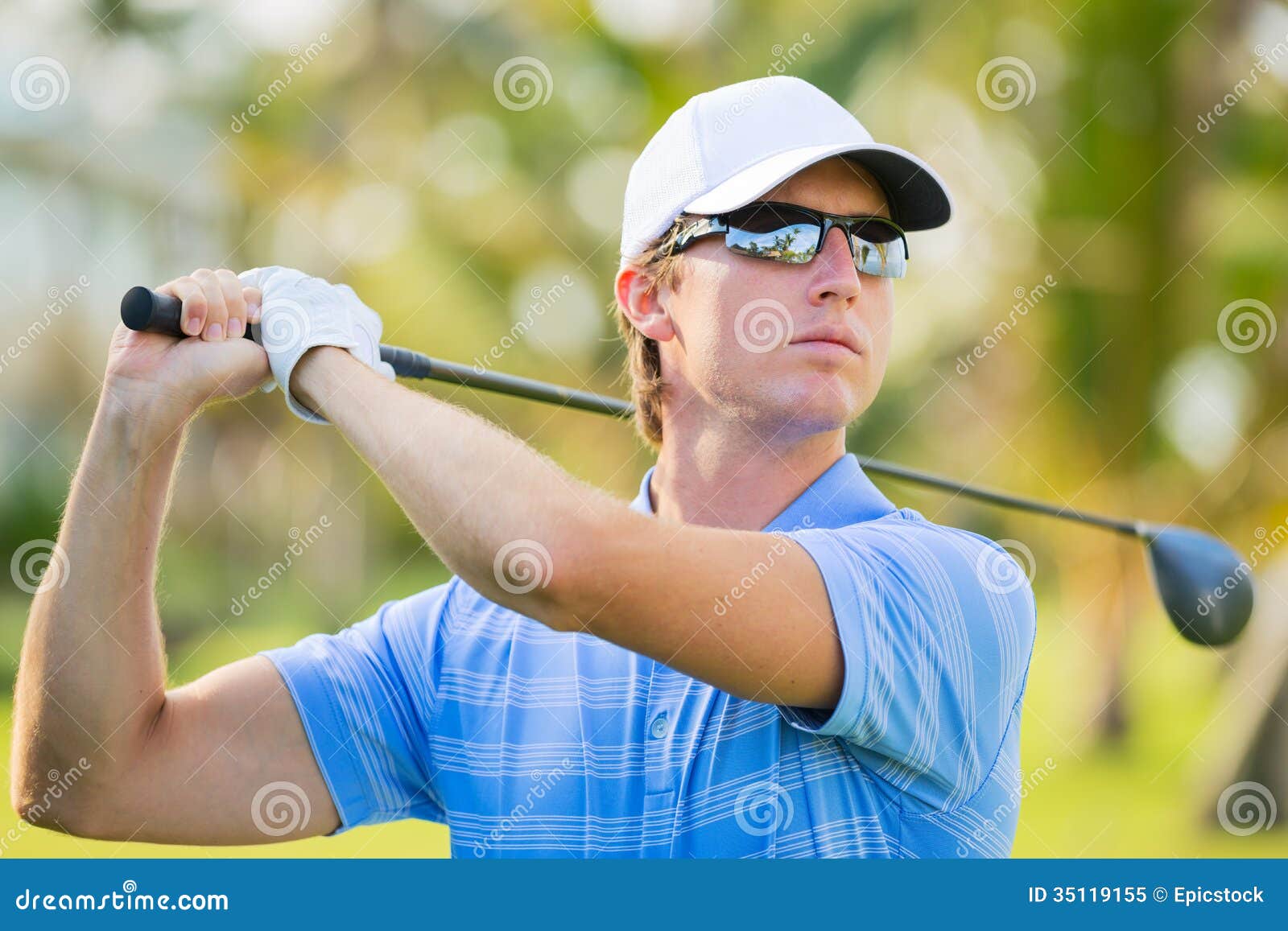Happy Young Man Swinging Golf Club Stock Image - Image of golf, ball ...