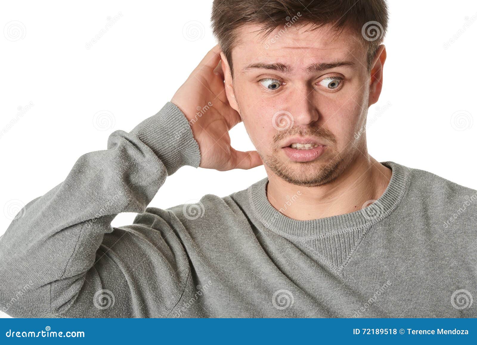 Happy Young Man with Uncertain Puzzled Expression, on Gray Background ...