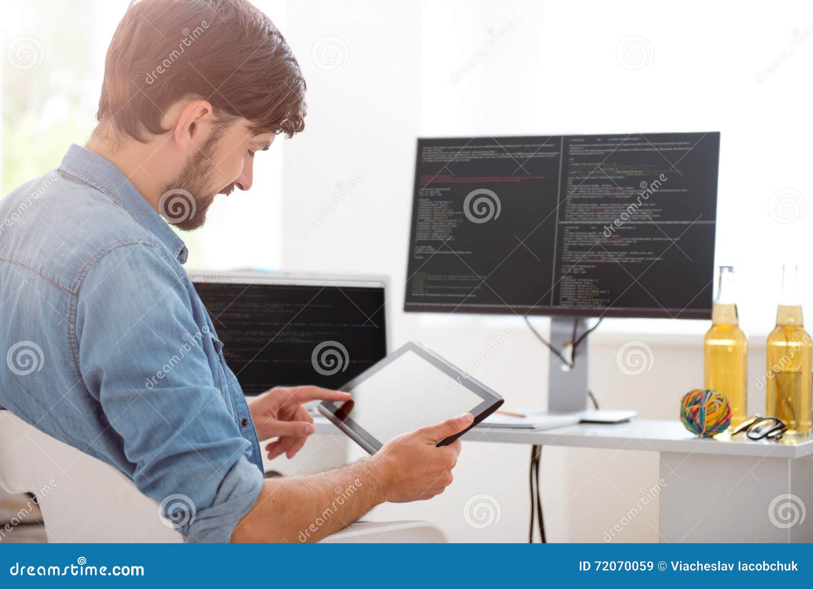 Happy Young Man Using His Tablet Stock Image - Image of hands, glasses ...