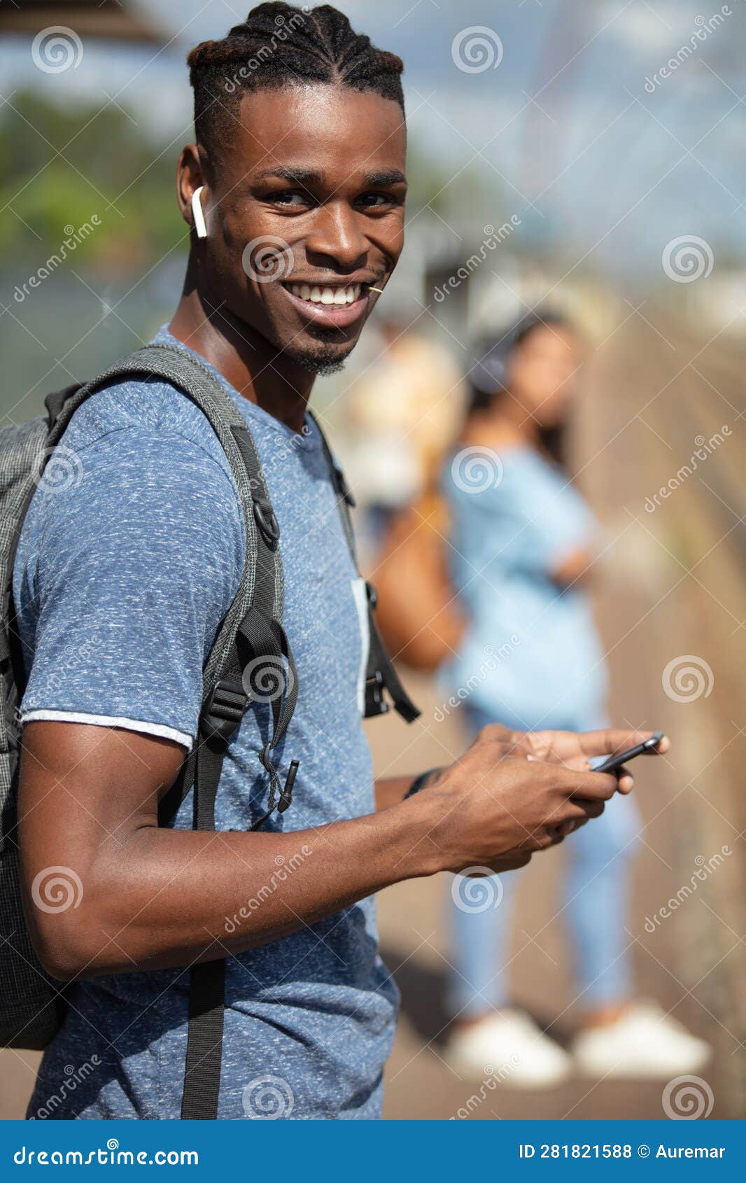 Happy Young Man Waiting for Train at Station with Bag Stock Photo ...
