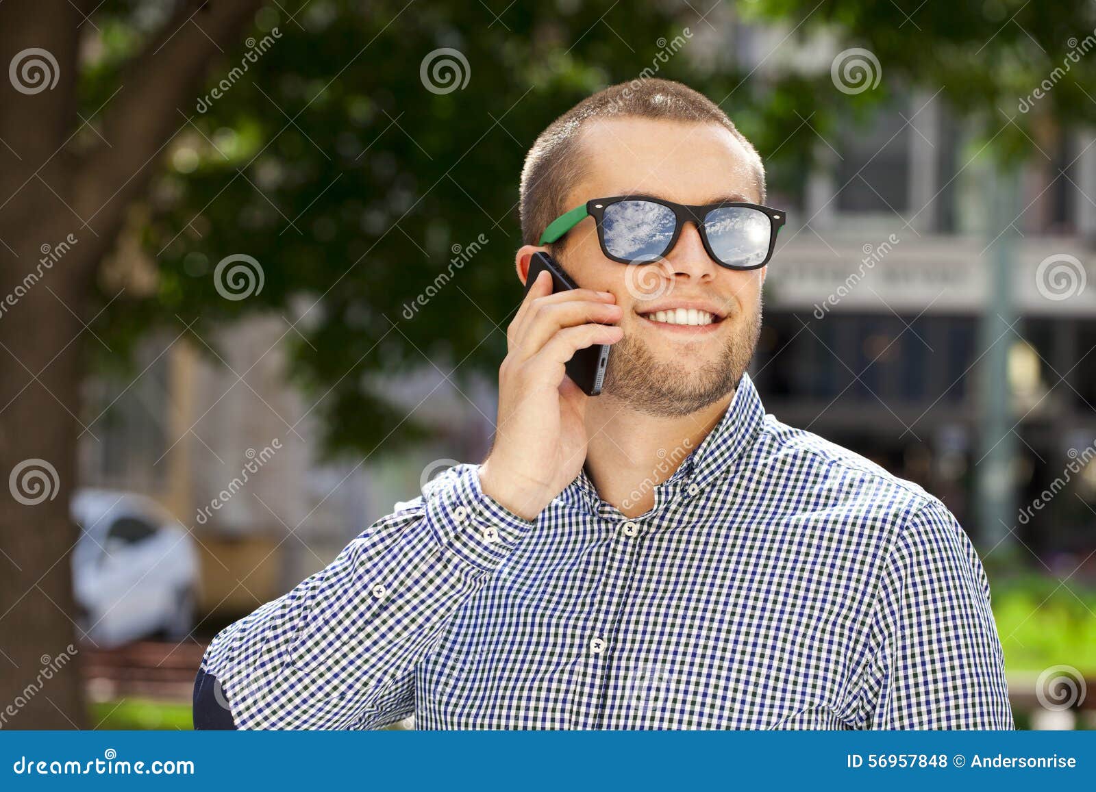 Happy Young Men Calling by Phone Stock Photo - Image of shirt ...