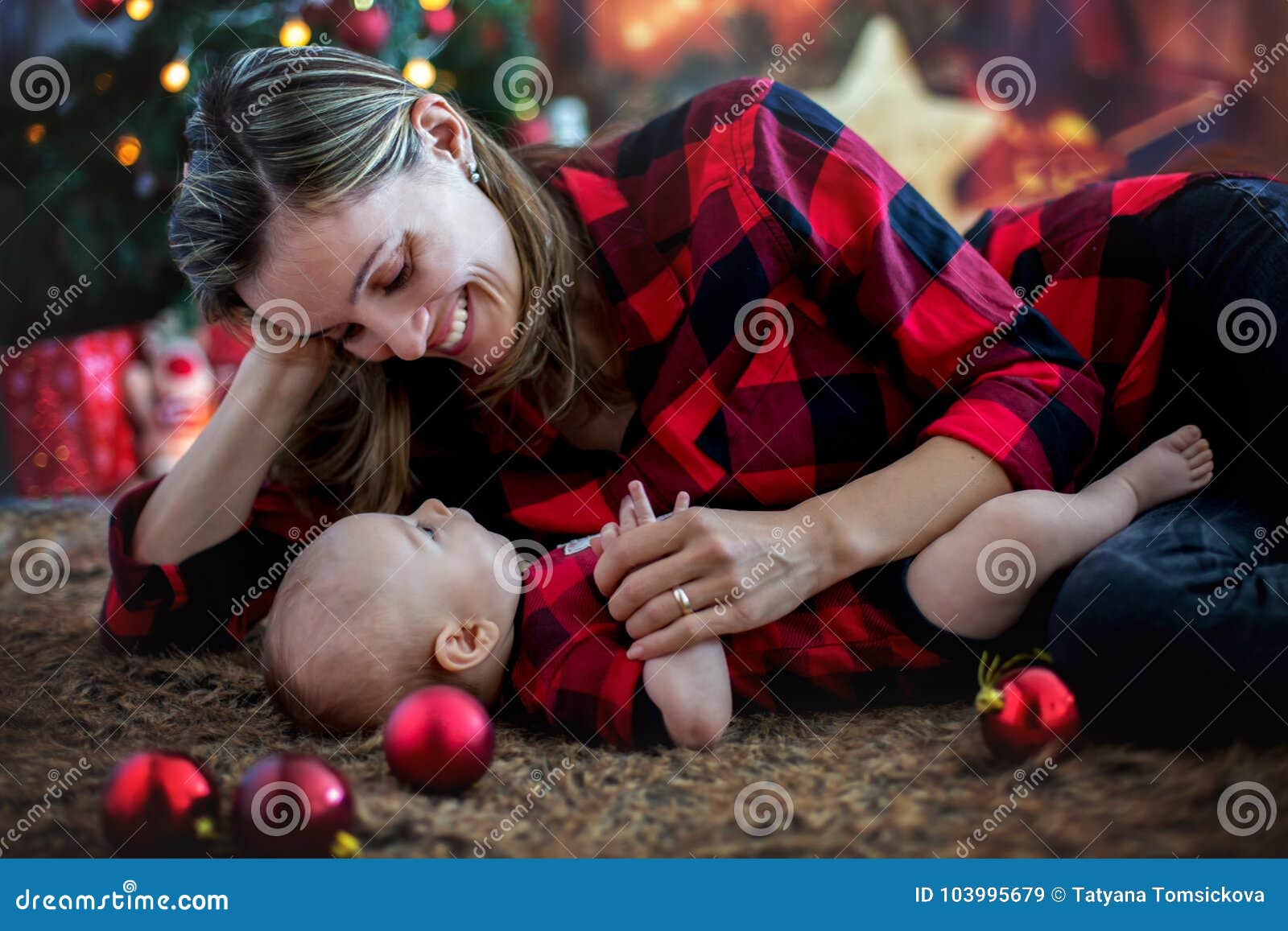 Happy Young Mother and Her Son Playing at Home during Christmas Stock ... Happy Young Mother and Her Son Playing at Home during Christmas Stock ...
