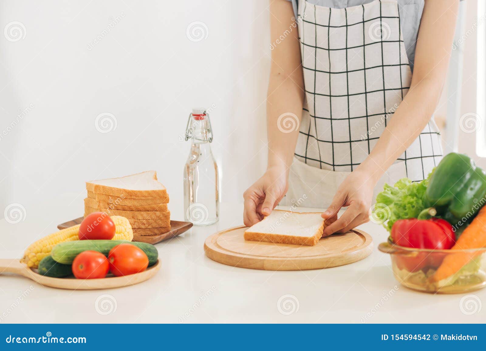 Happy Young Mother Preparing Snacks in the Morning at Home Kitchen ...