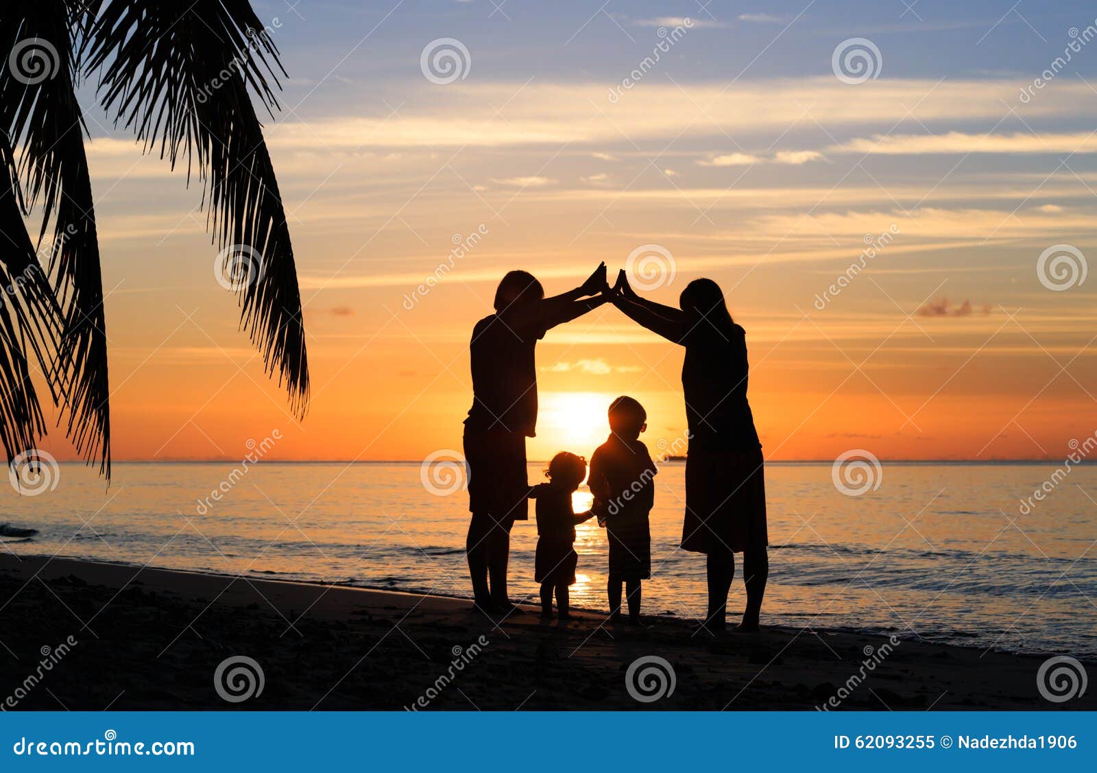 Happy Young Parents Making Home for Kids at Sunset Stock Image - Image ...