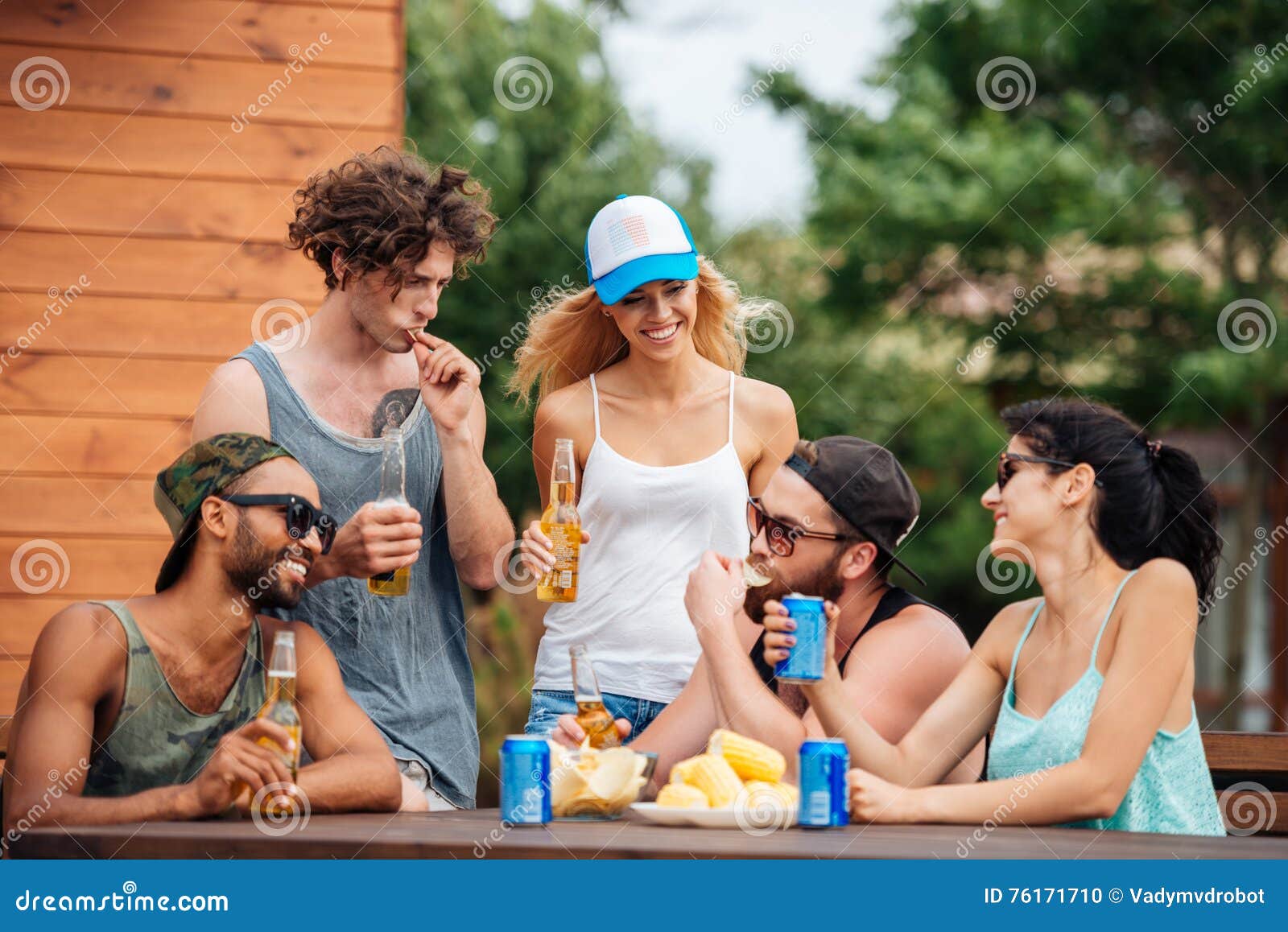 Happy Young People Eating and Drinking Outdoors Stock Photo - Image of ...