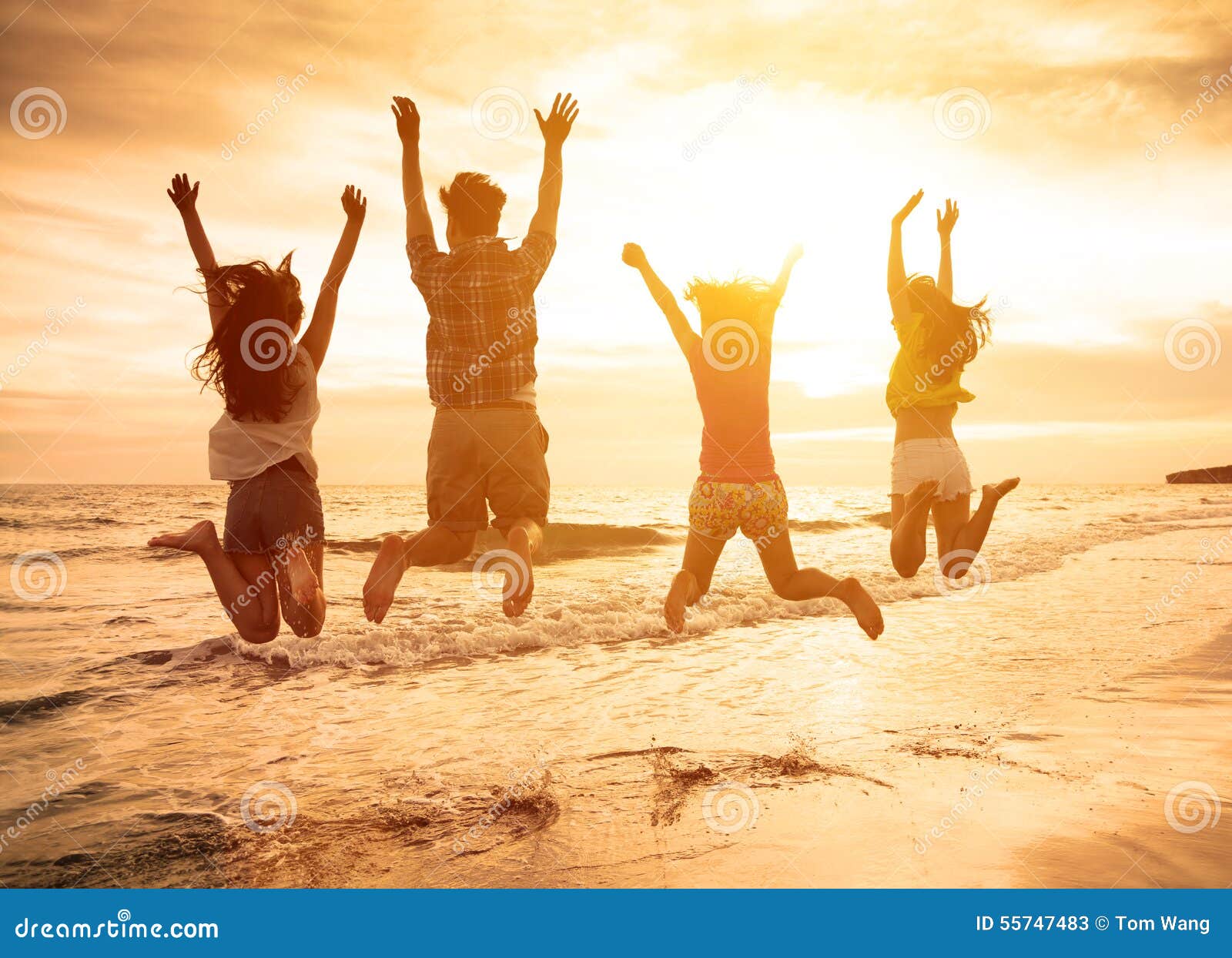 Happy Young People Jumping on the Beach Stock Image - Image of ...