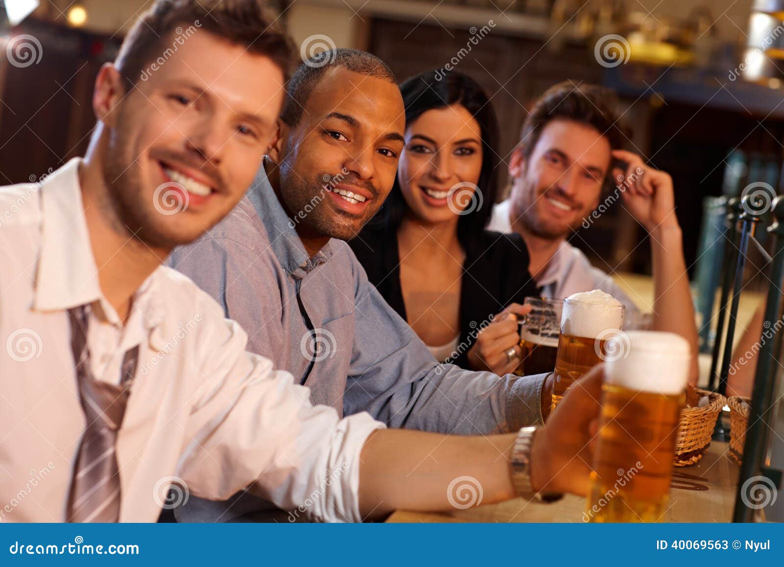 Happy Young People Sitting in Pub, Drinking Beer Stock Image - Image of ...
